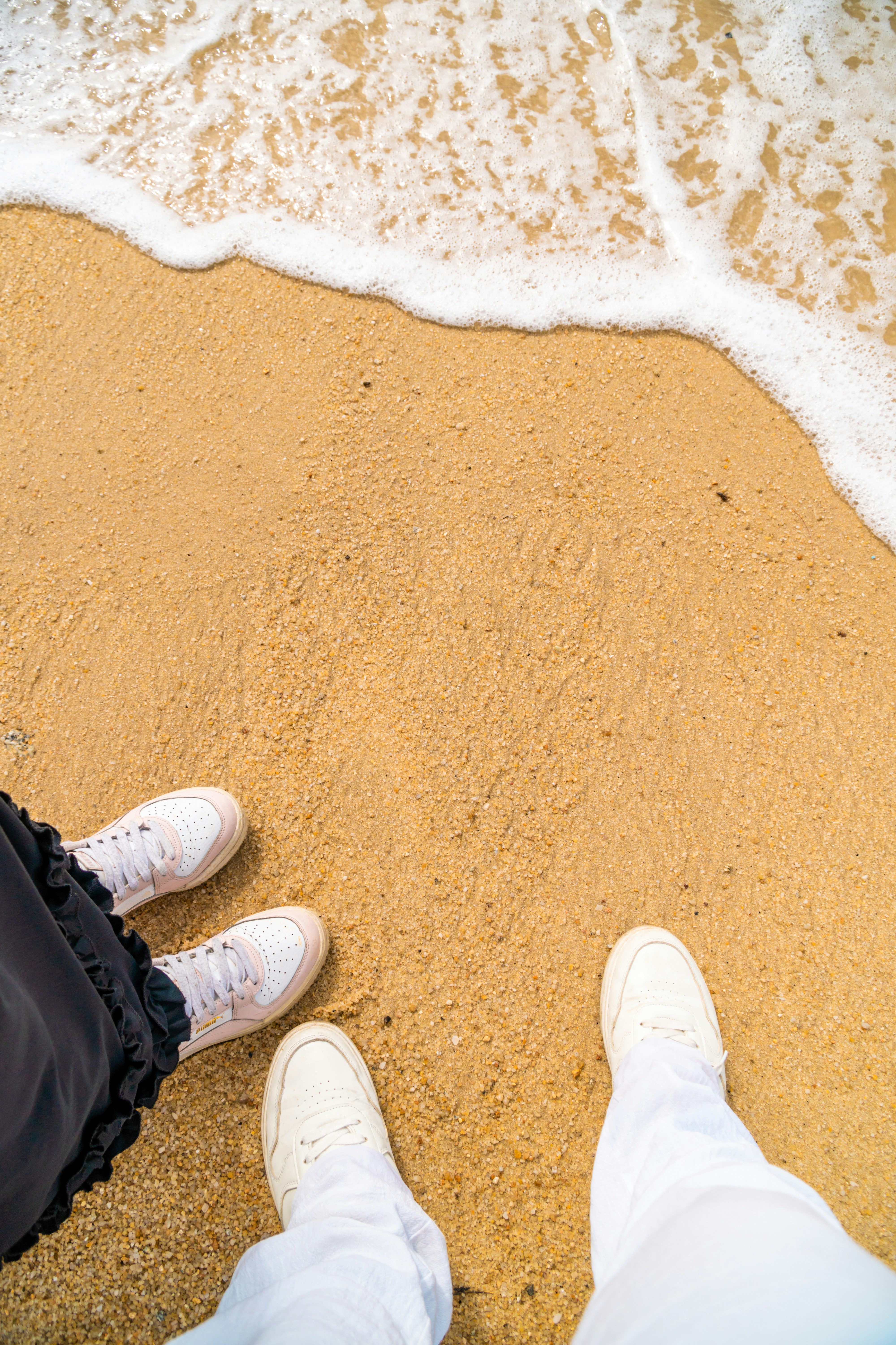 First Steps to the Shoreline: Footprints on Warm Sand