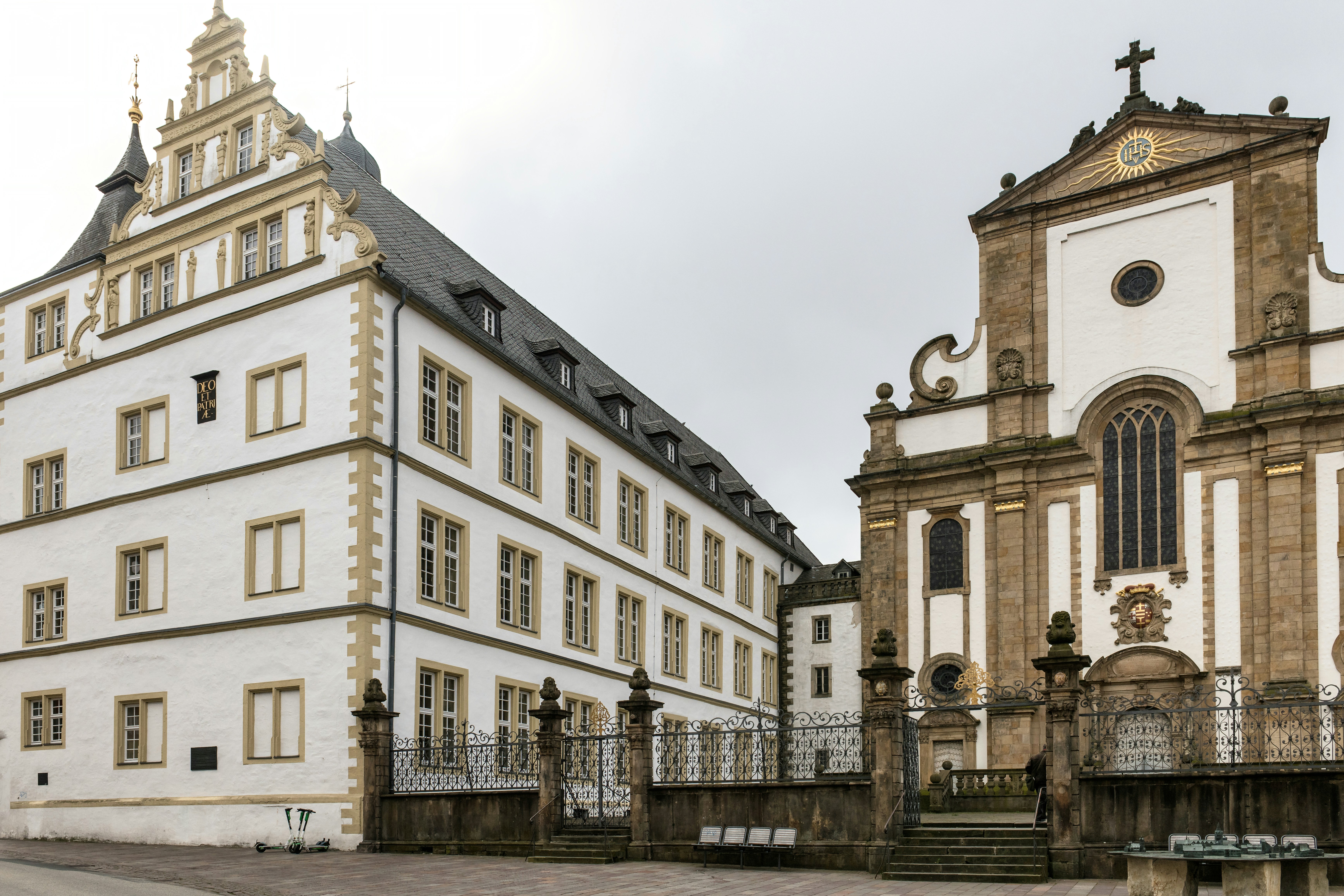 Façade Confluence: Baroque Church Meets Historic Manor