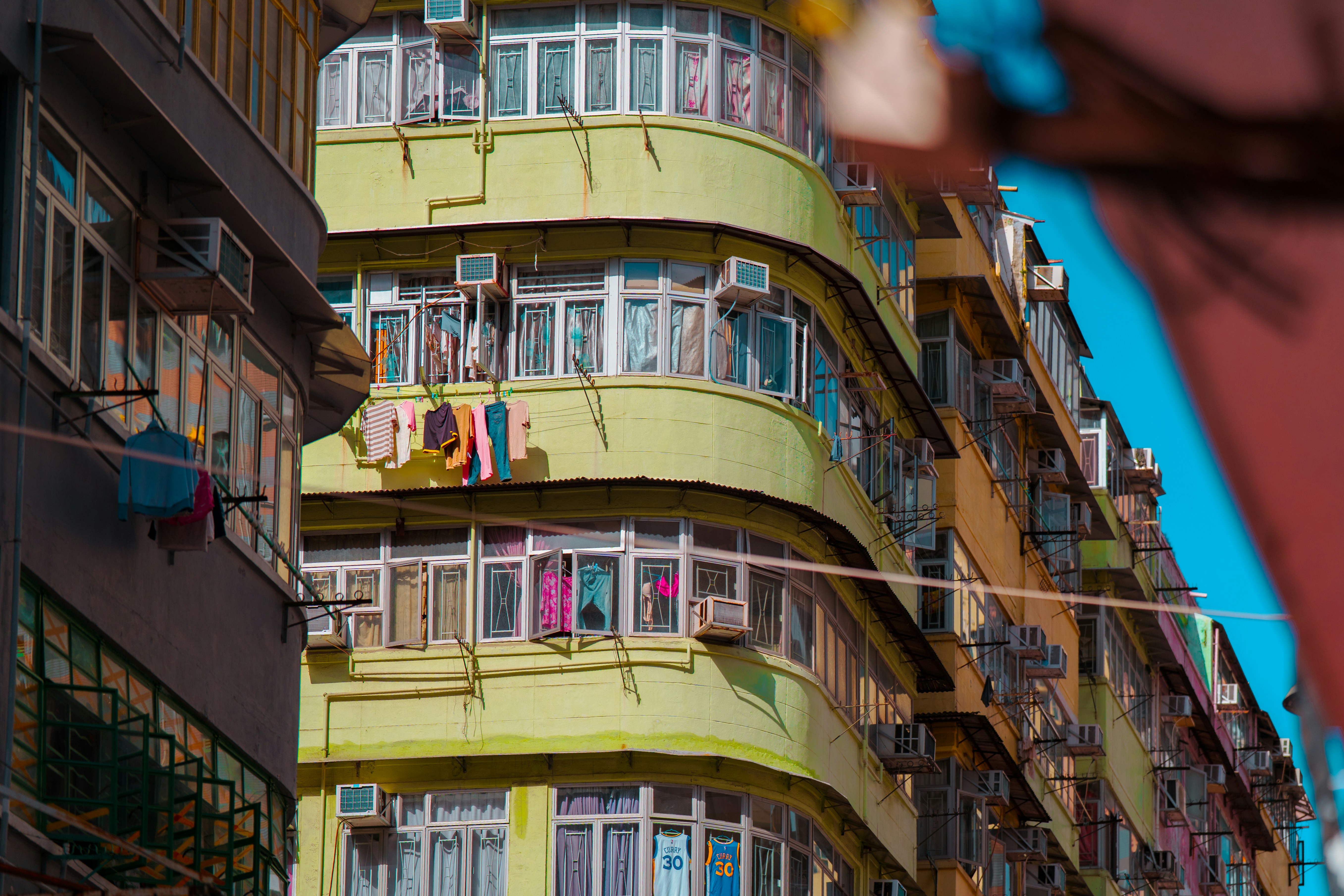Rounded Facades and Bright Laundry: Colorful Urban Corners