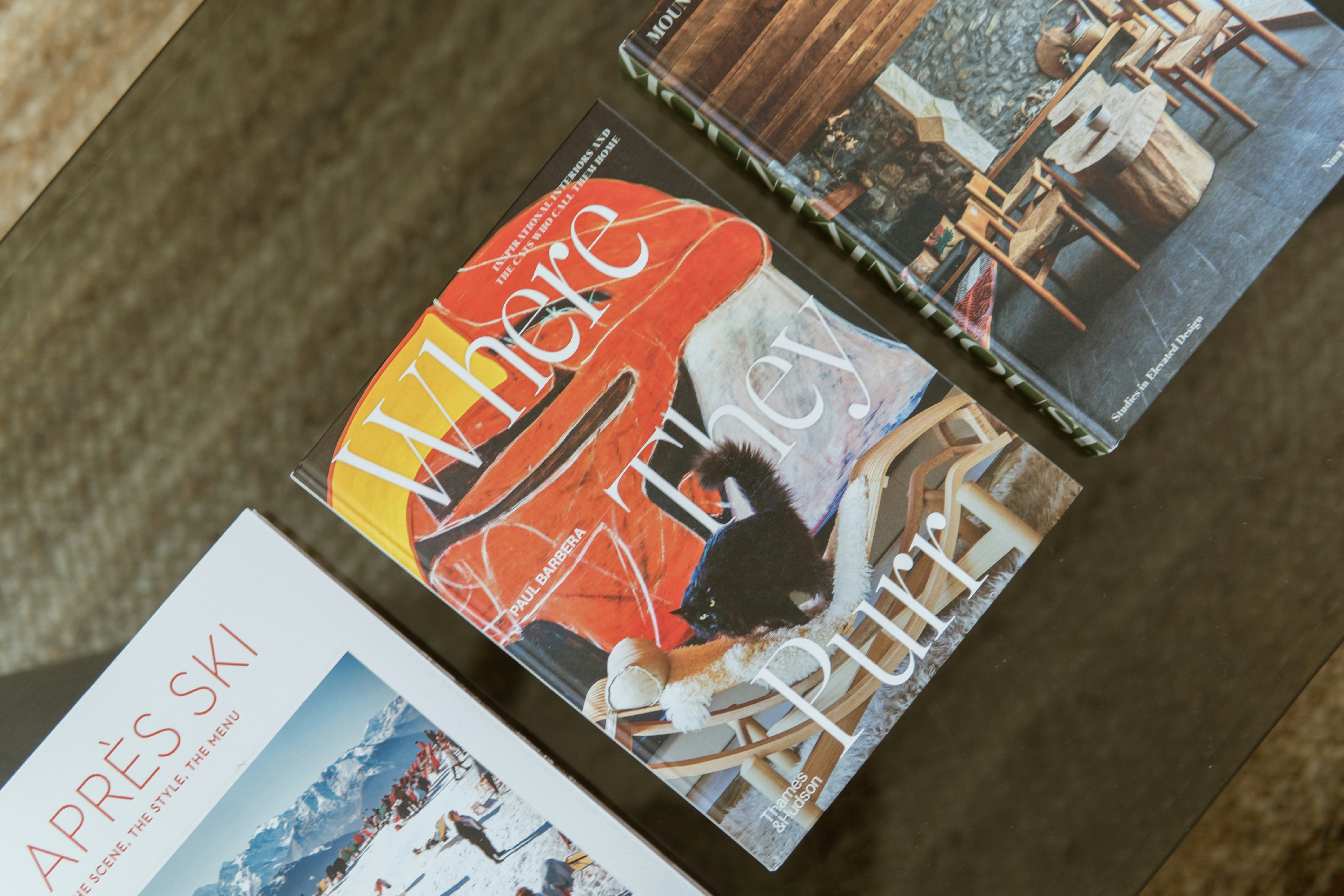 Curated Relaxation: A Tilted Desk of Magazines and Travel Tomes
