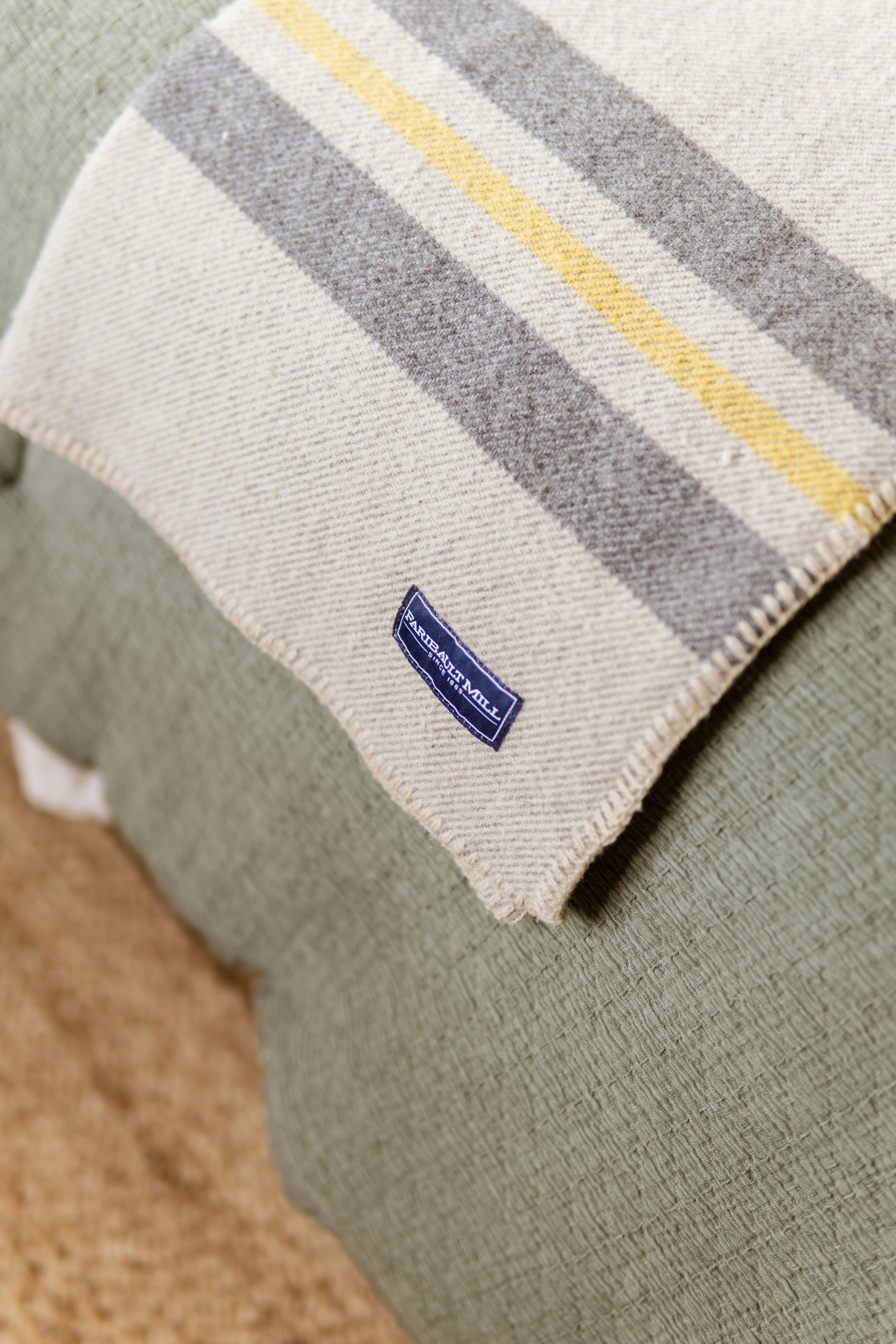 Textured Comfort: A Woolen Stripe Draped Over Upholstery