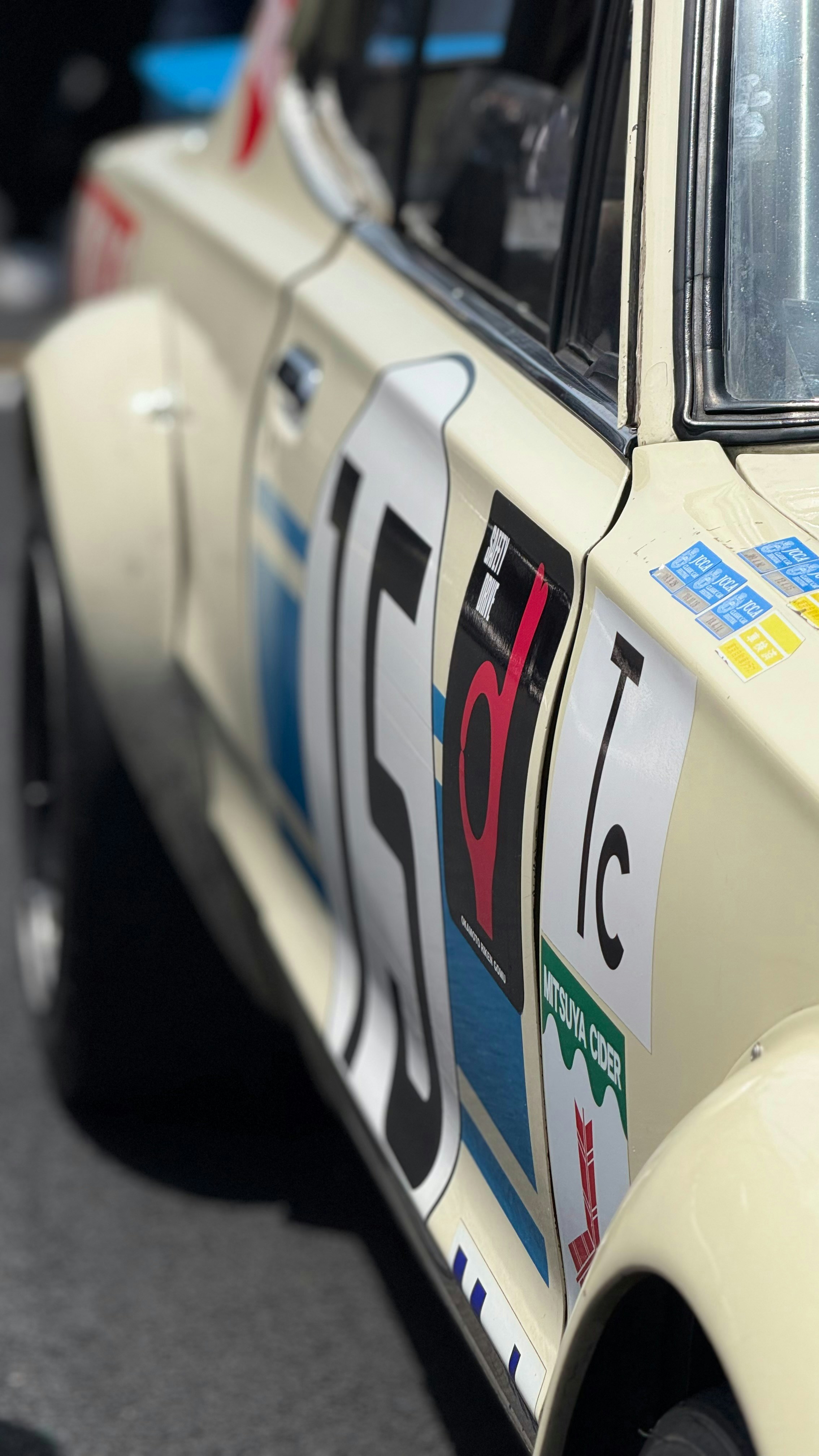 Stickered Classic: A Vintage Racing Car Close-up