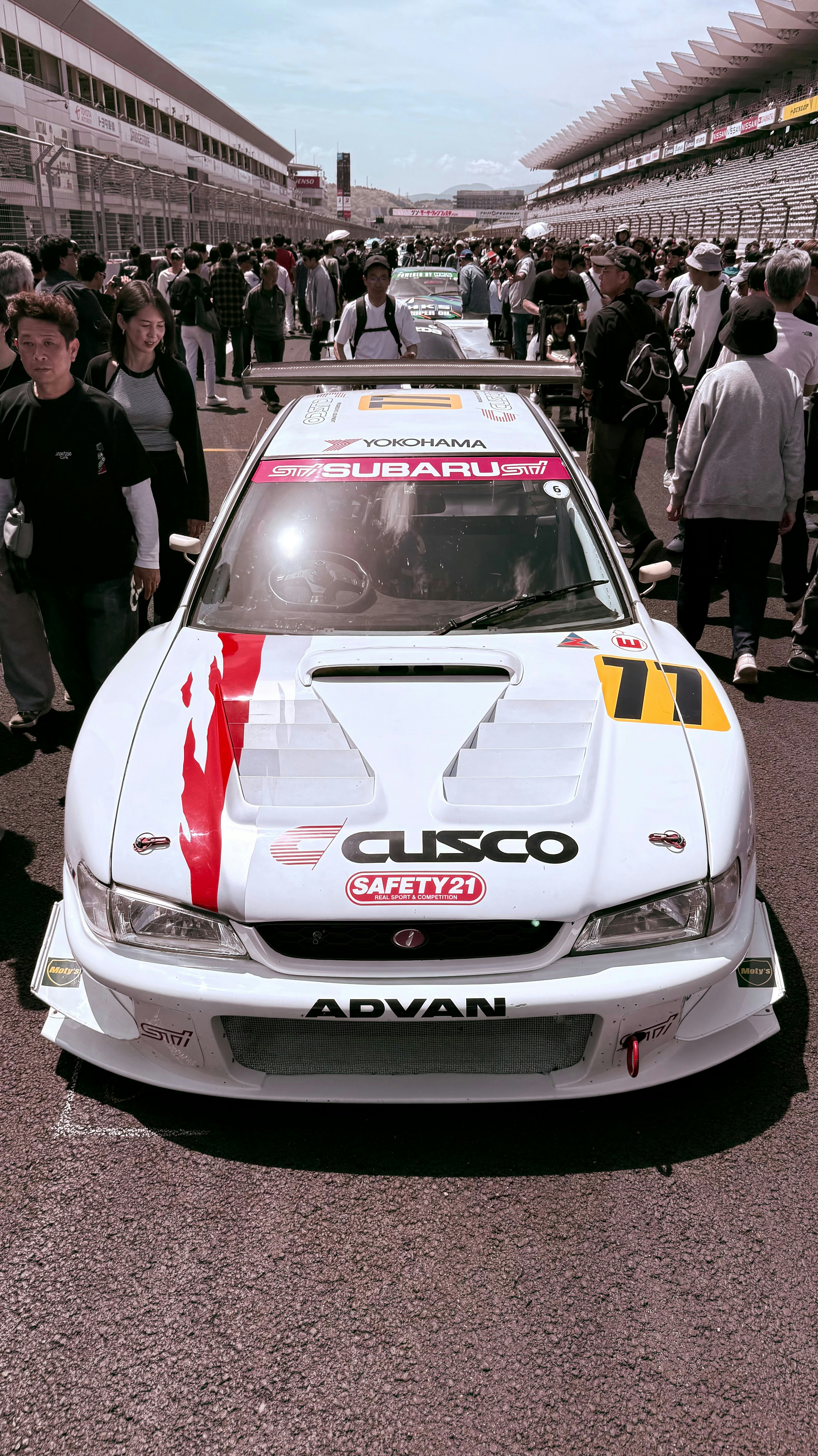 Front-Row Spectacle: The Subaru Racing Car at the Paddock Concourse