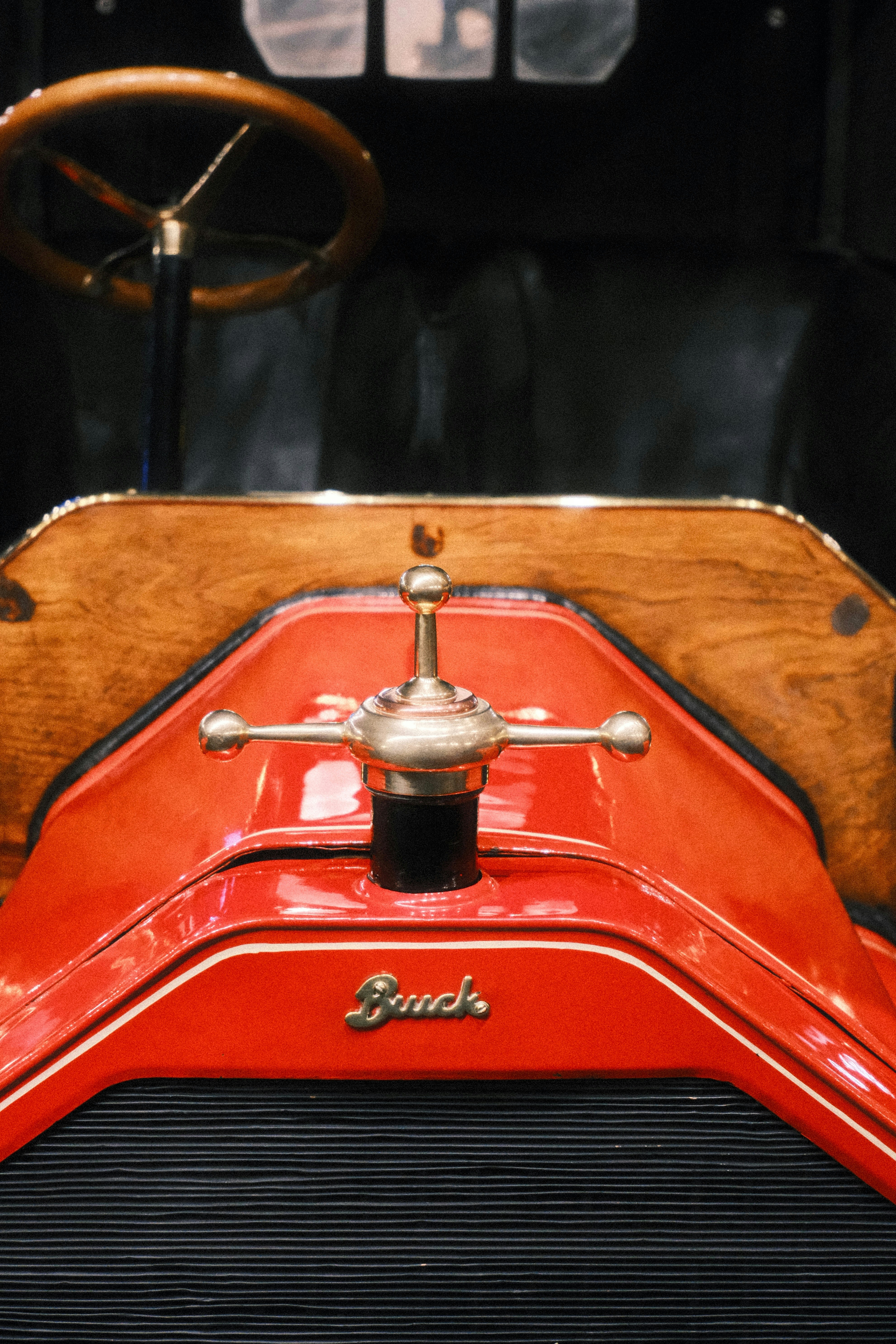 Red Racer: Vintage Buick Steering a Glimmering Red Front