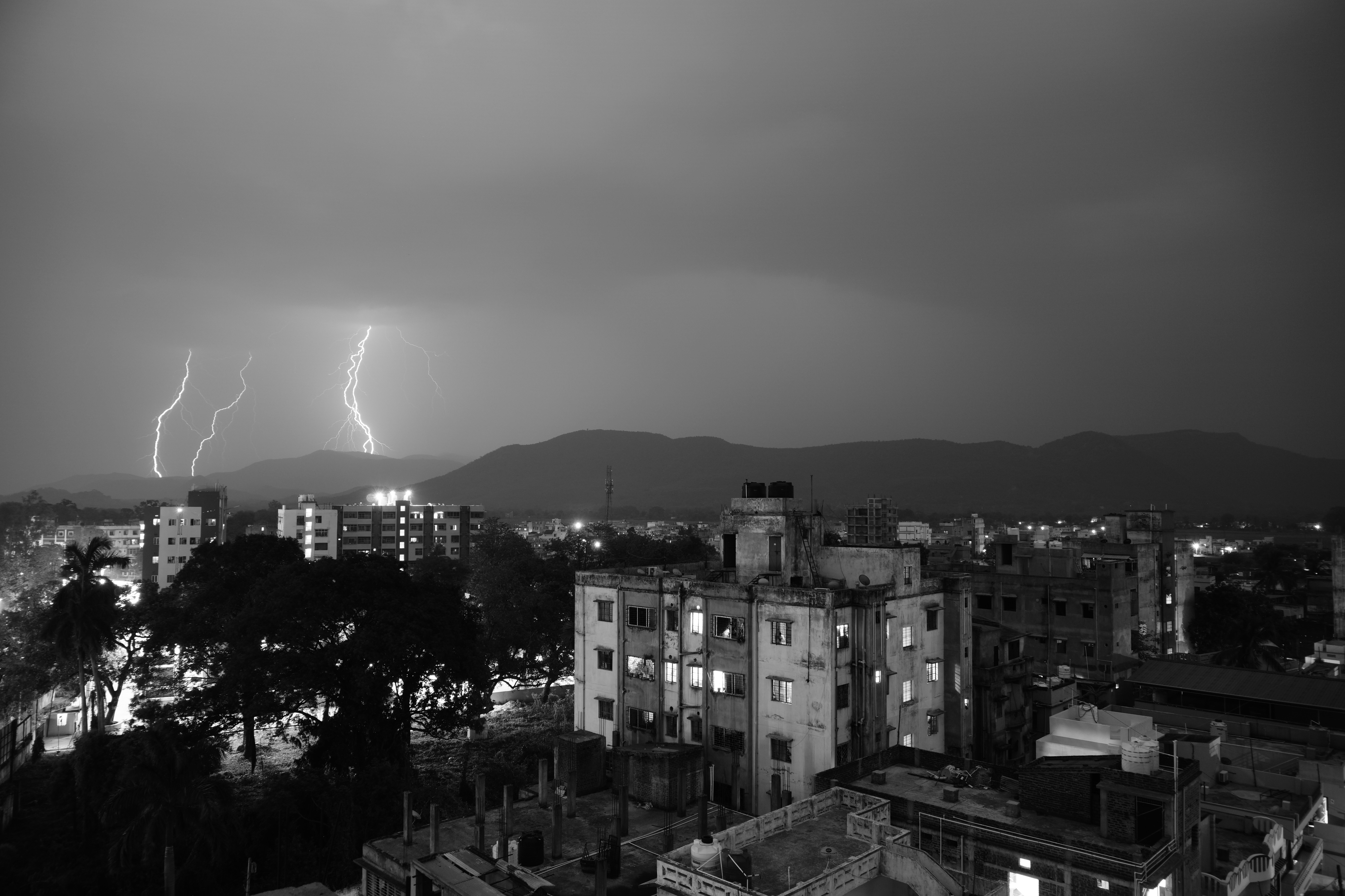 Lightning over the city: a nocturnal storm over low-rise skyline