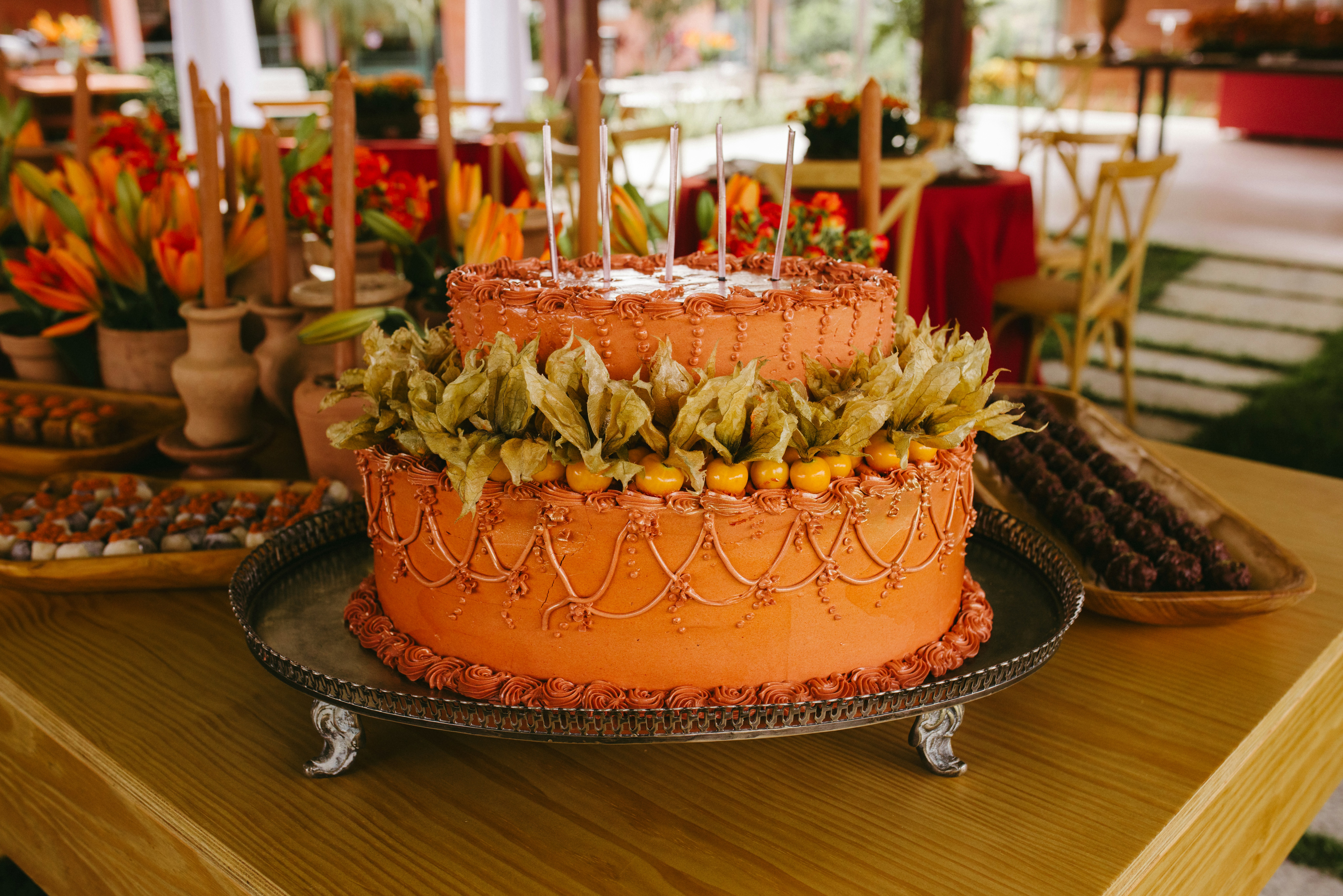 Two-Tier Caramel Blossom Cake on a Decorated Reception Table