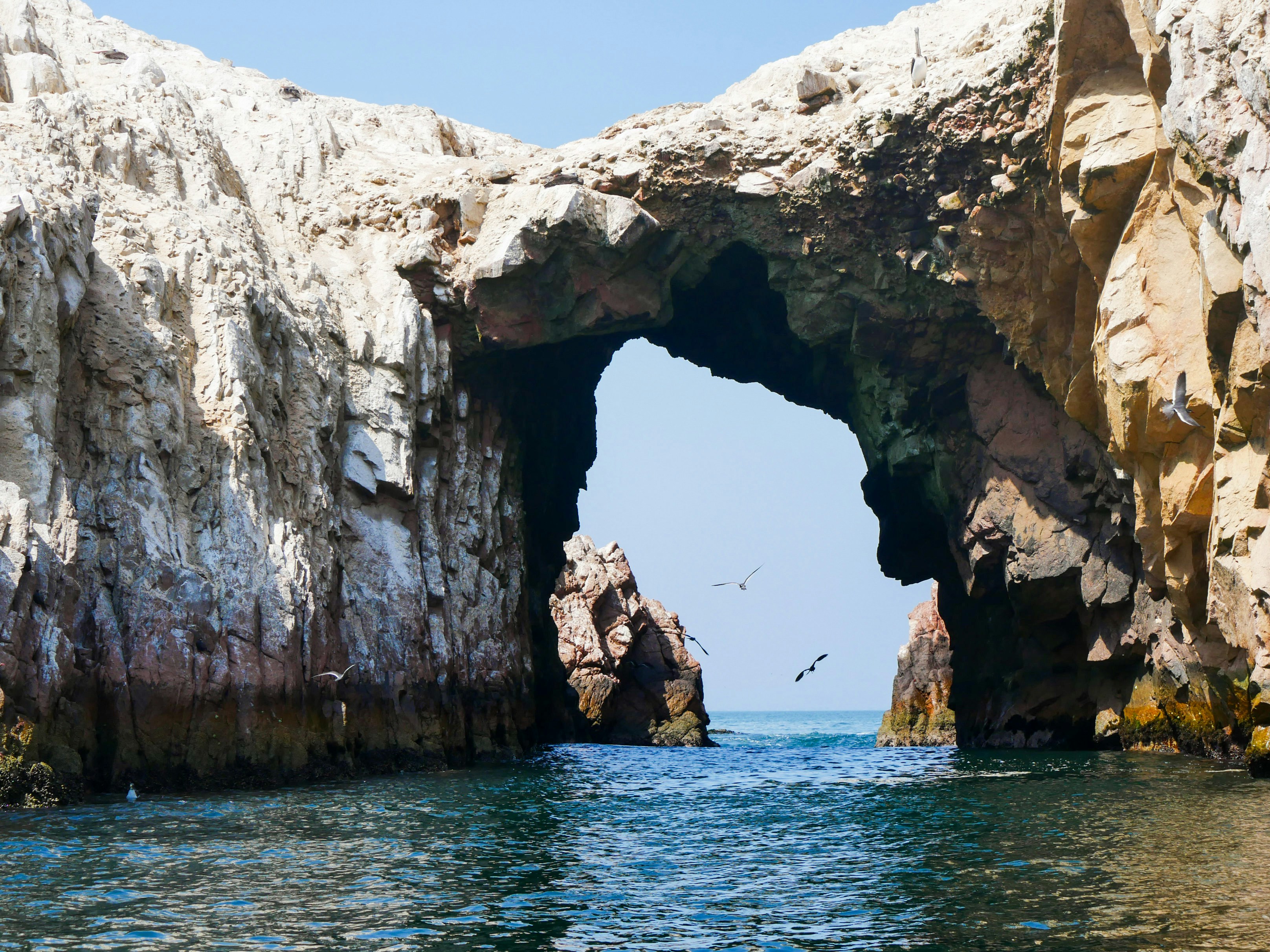 Rock Arch Over Azure Water: Ocean Gate Frame