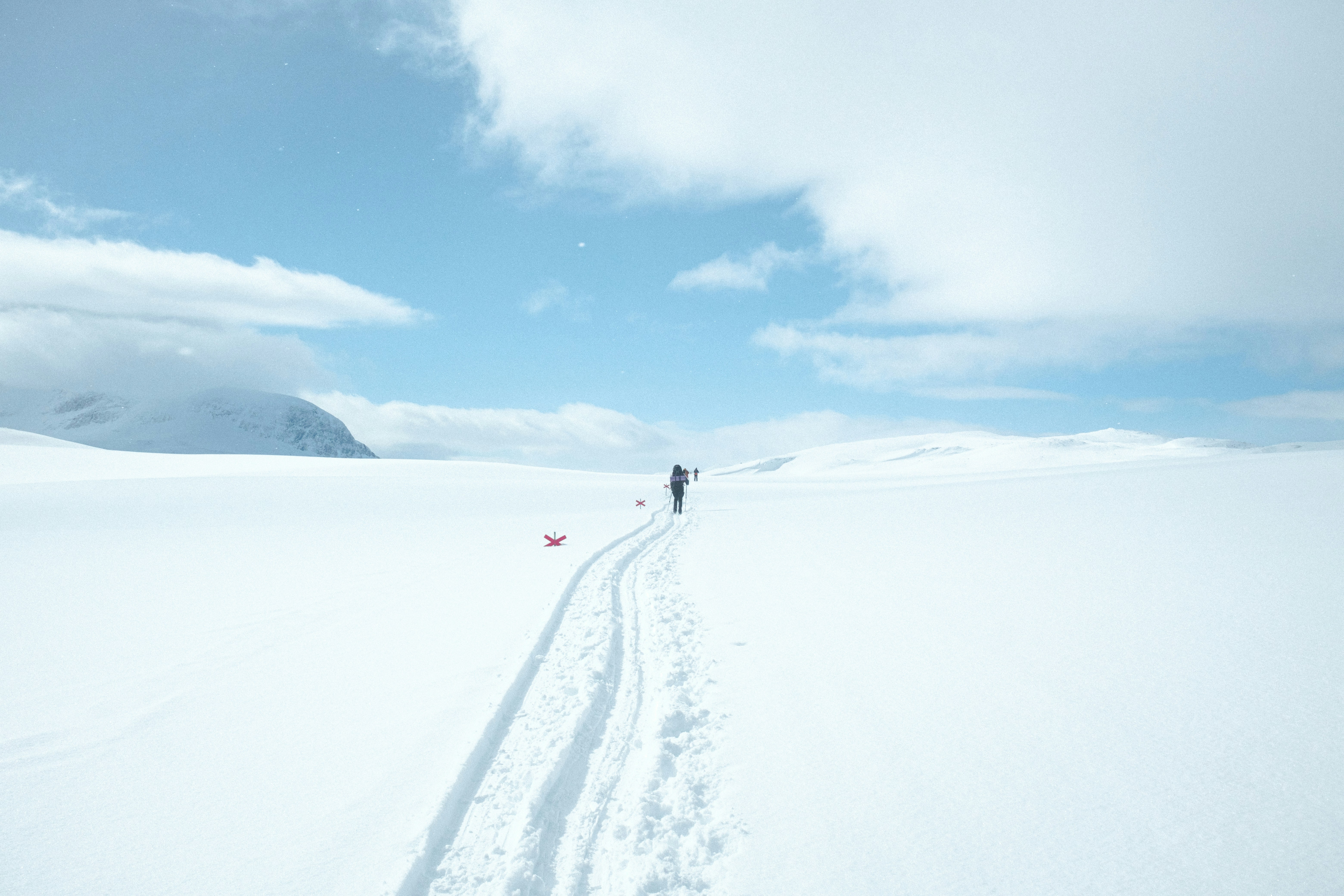 Snowbound Trek: A Lone Traveler Tracing the Powder Trail
