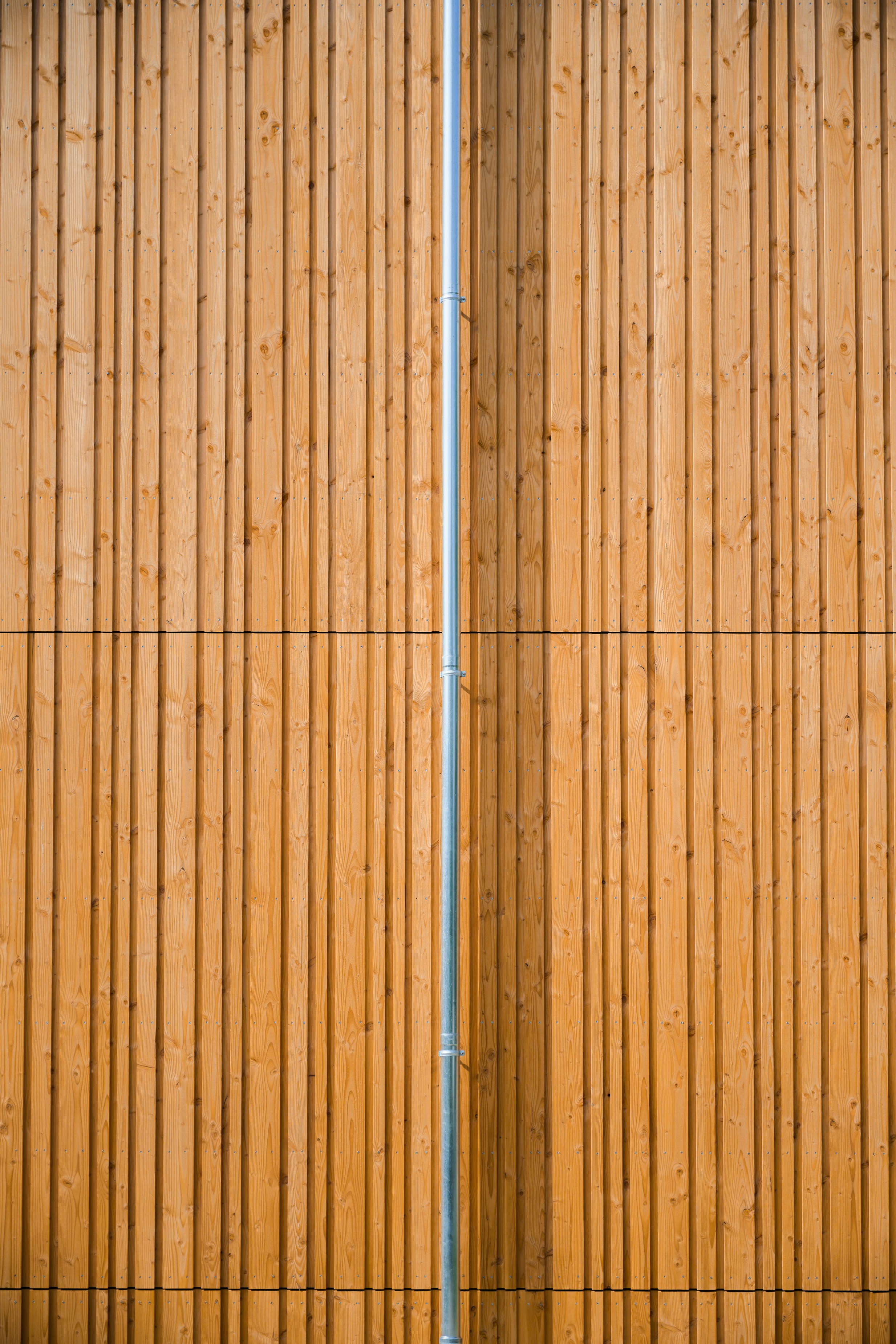 Vertical Slats of Warm Wood Dividing the Frame
