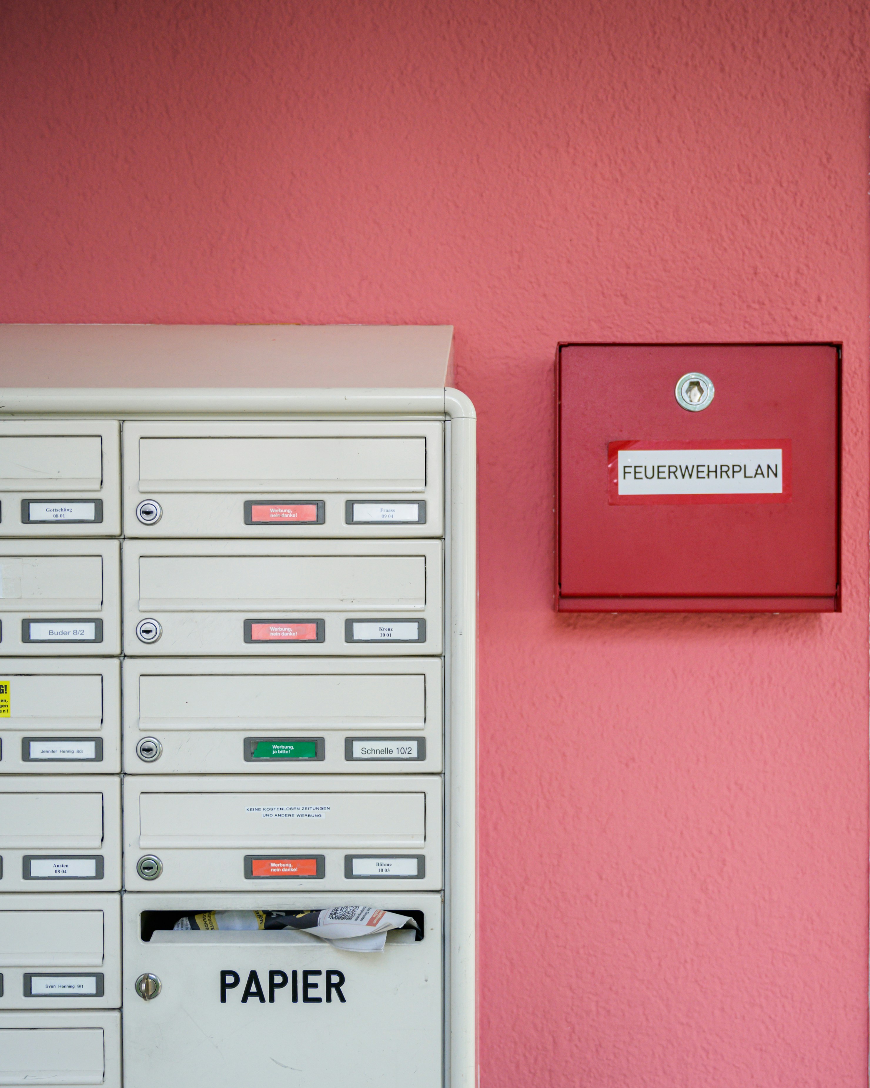 Pink Facade with Mailboxes and Fire Plan Box