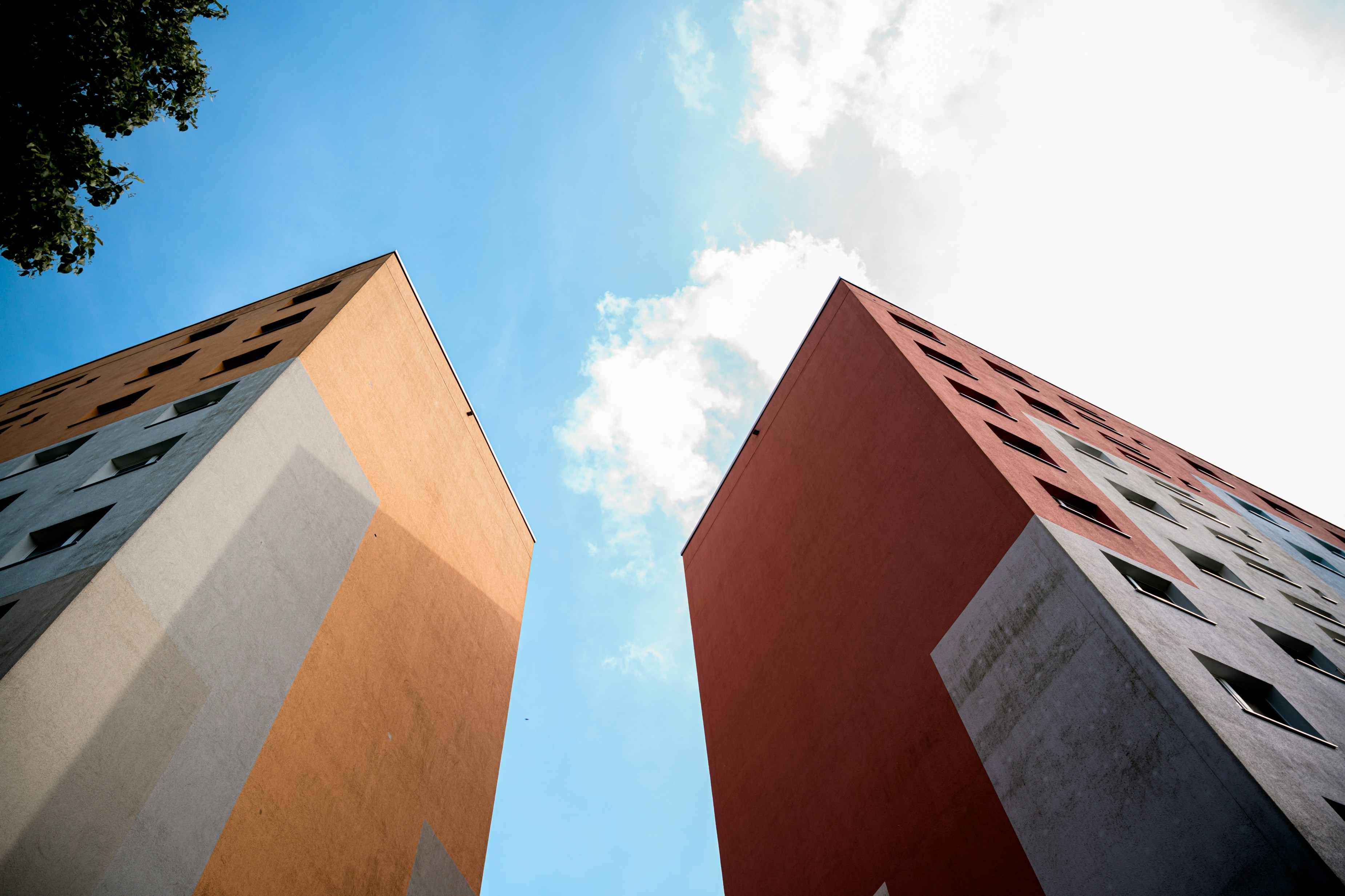 Vertical Giants Reach for the Sky: A Skyward View Between Tall Flats