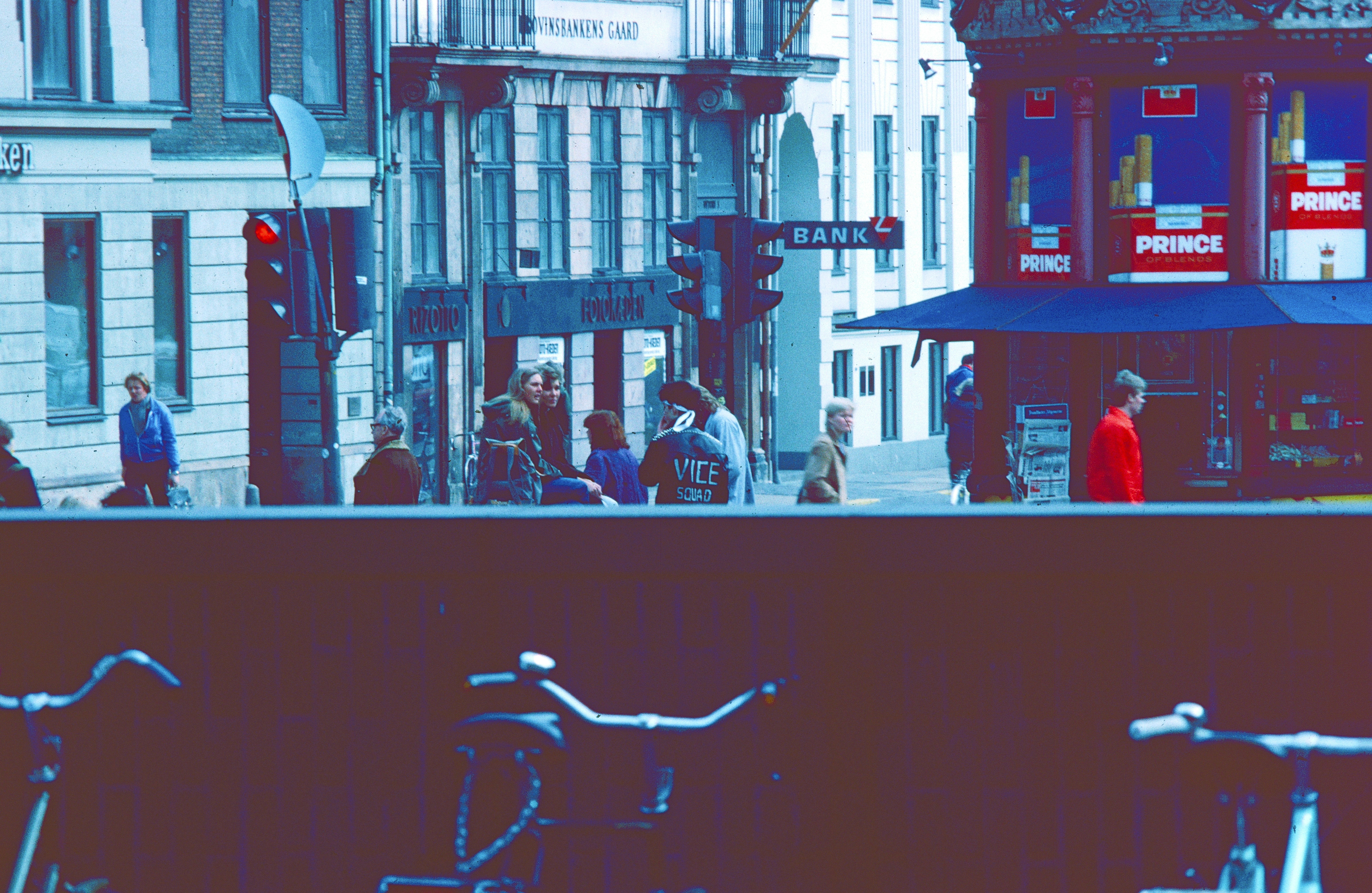 City in Cyan: Street Scene with People and Bicycles