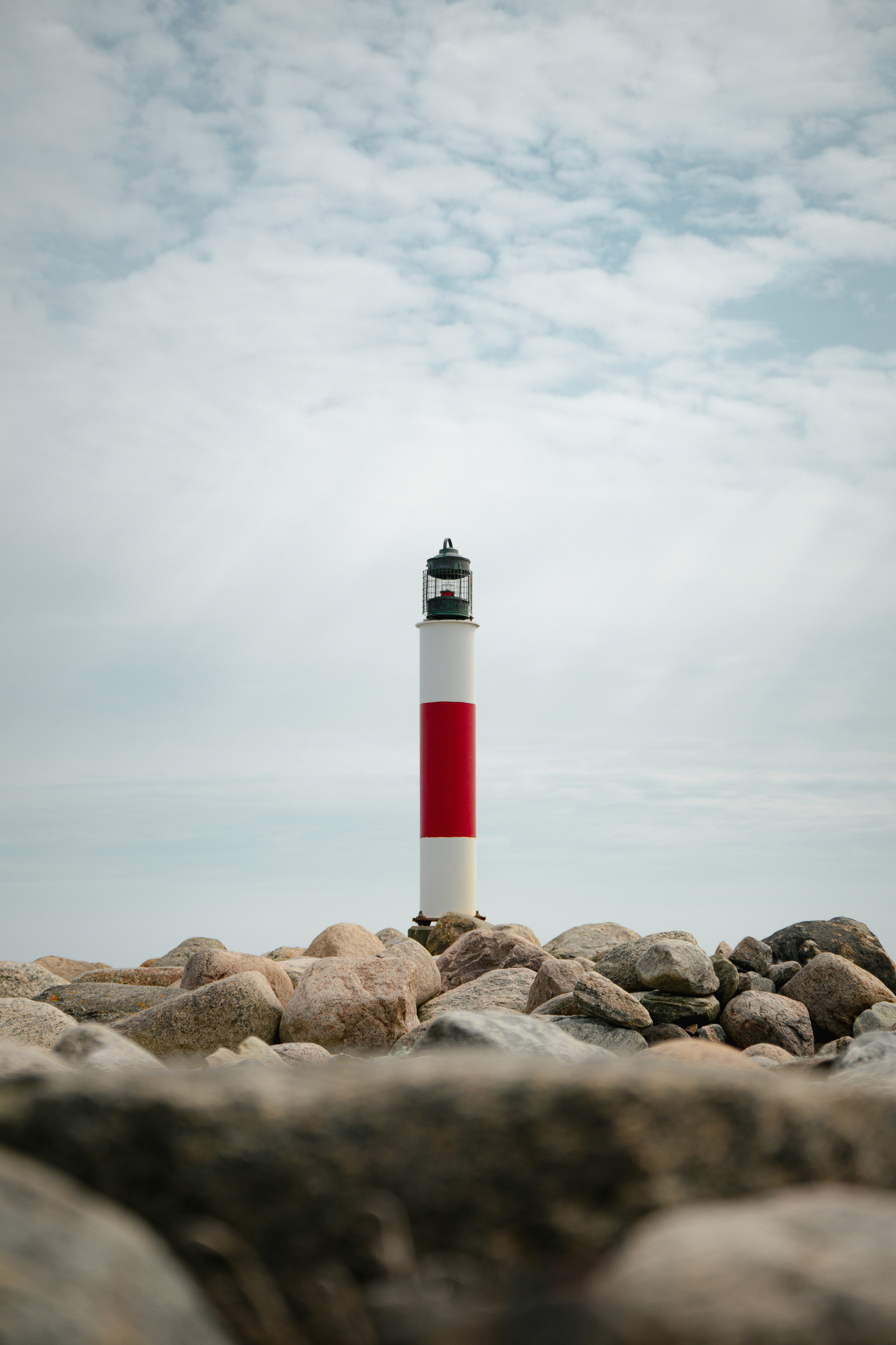 Lighthouse Sentinel Over the Tumbled Rocks