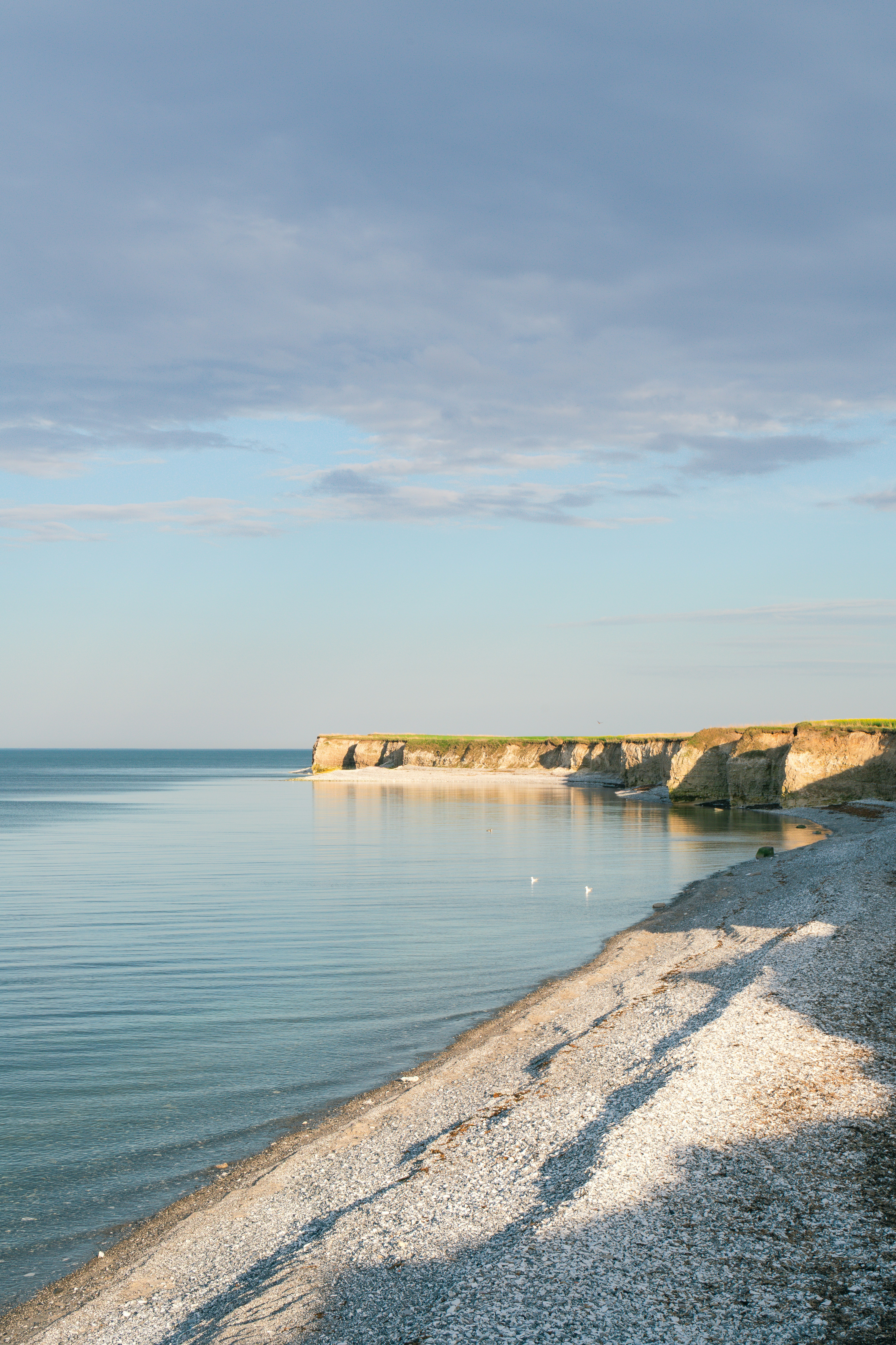 Coastal Light: Quiet Sea Edge Under a Pale Sky