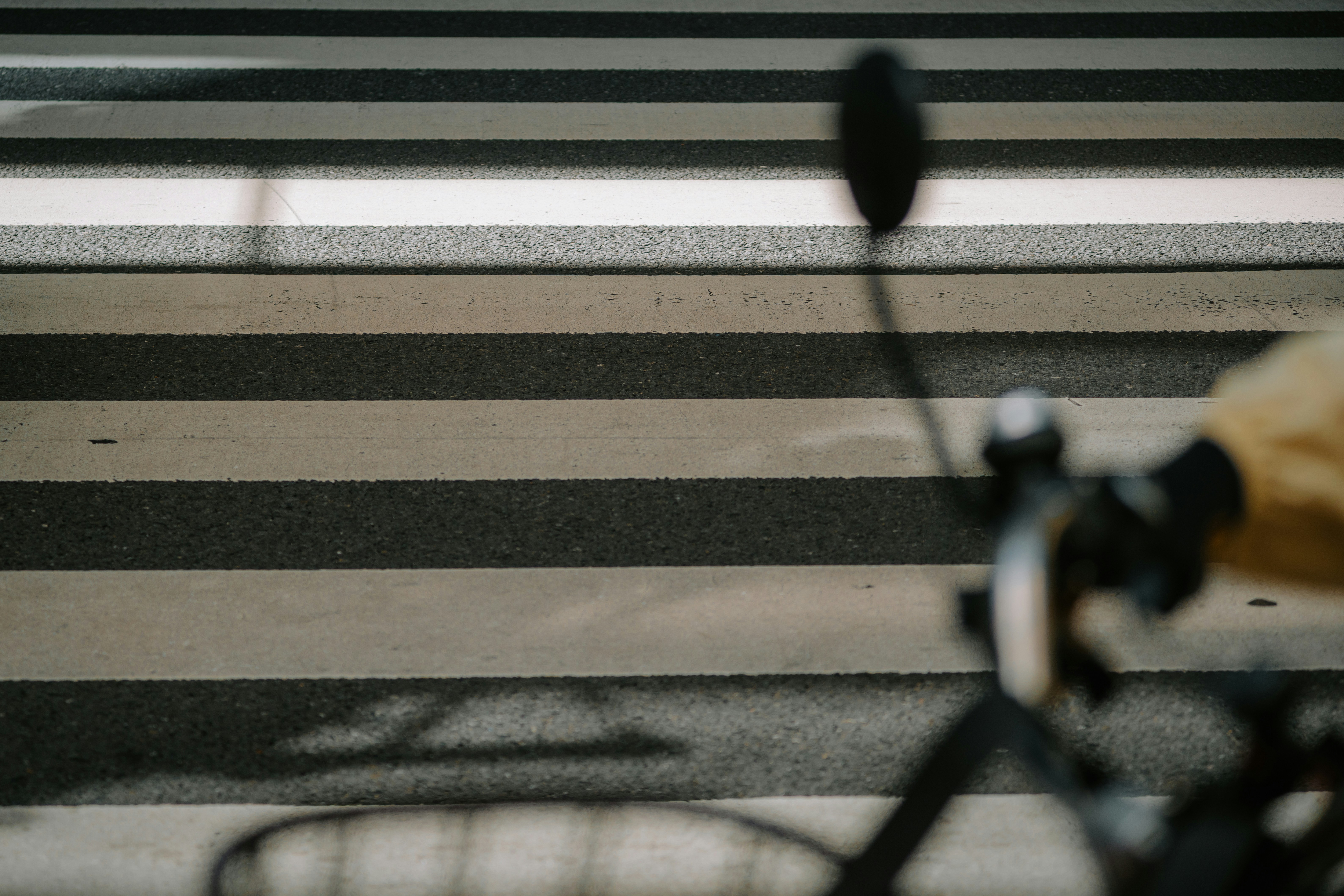 Blurred Rider at the Edge of the Crosswalk