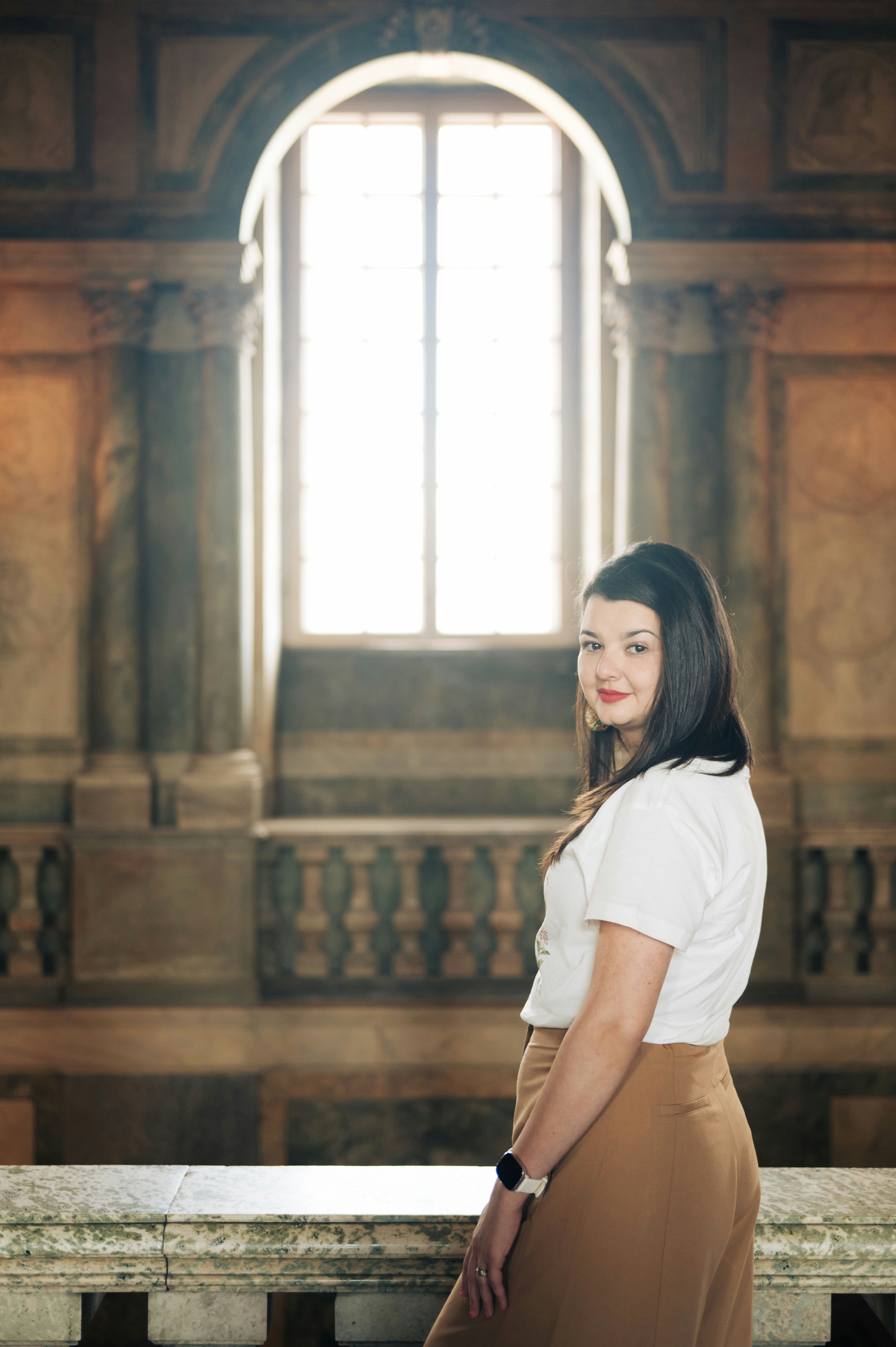 Portrait in a Marble Hall: Subtle Confidence in Cathedral Light
