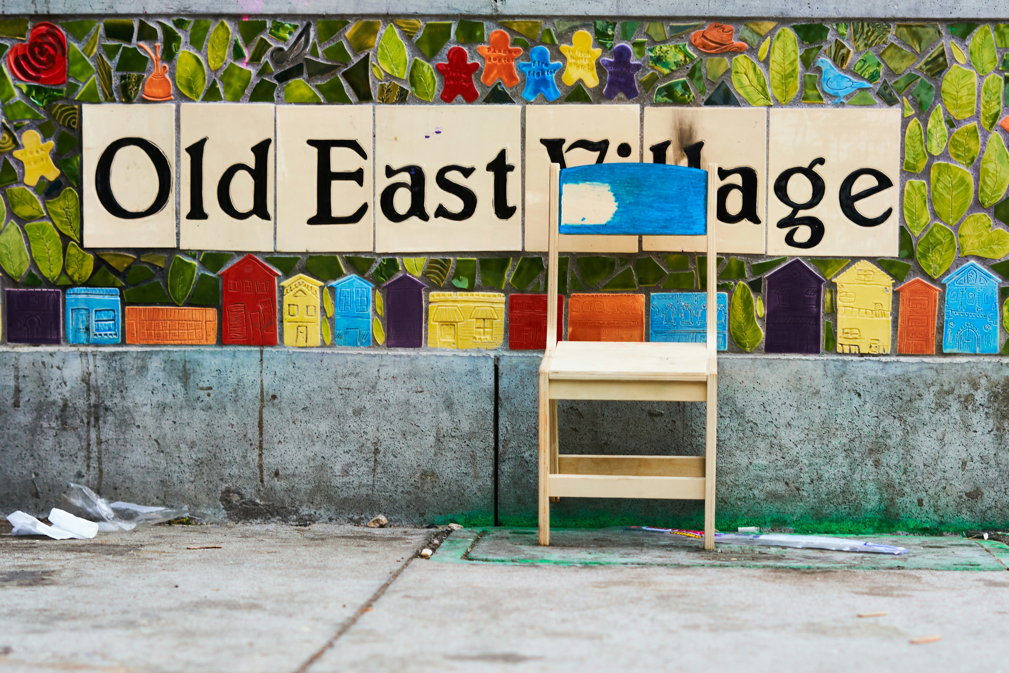 Chair Against a Colorful Mosaic: Stillness in Old East Village