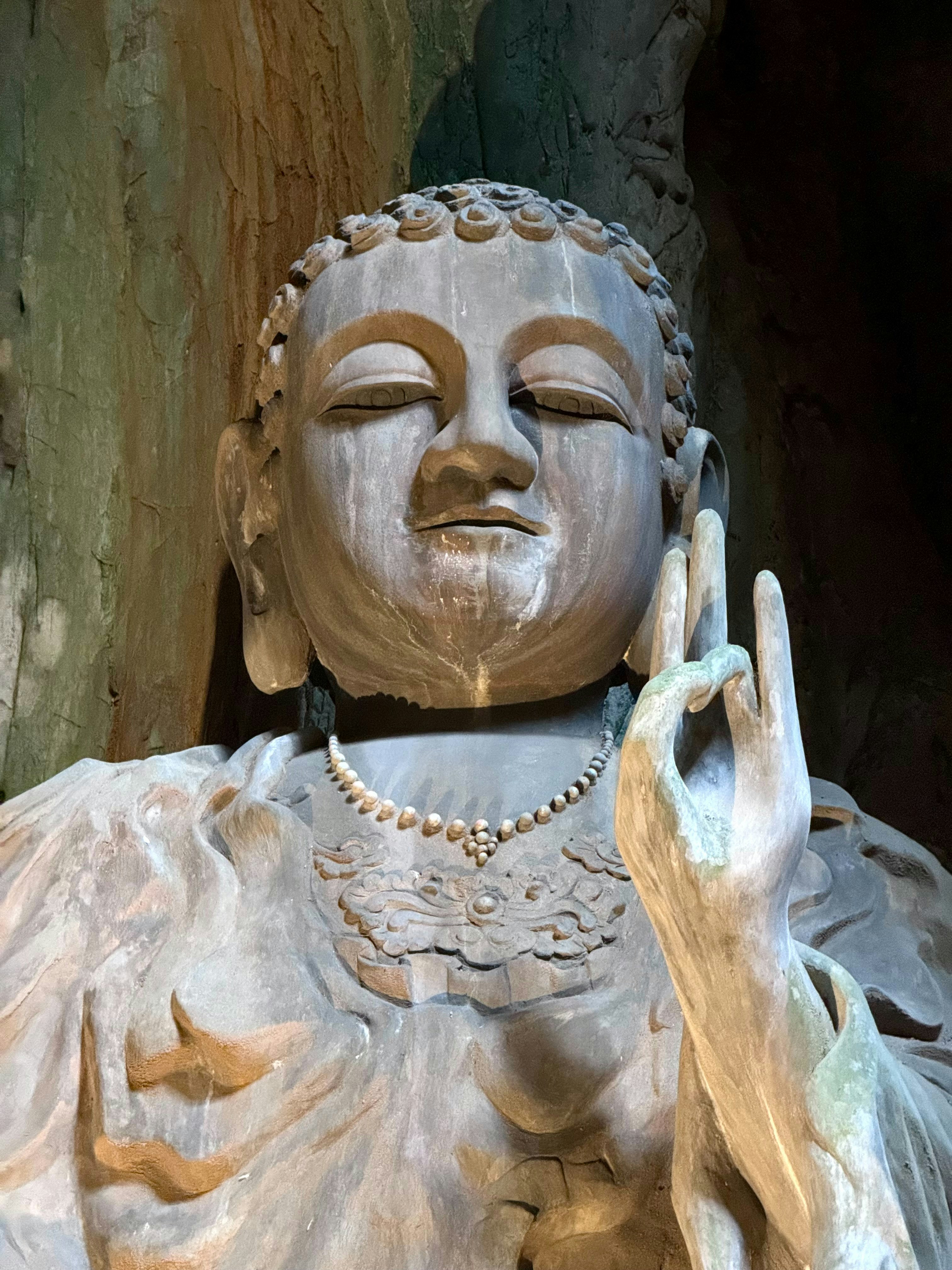 Calm Resonance: Stone Buddha in Gentle Side Lighting
