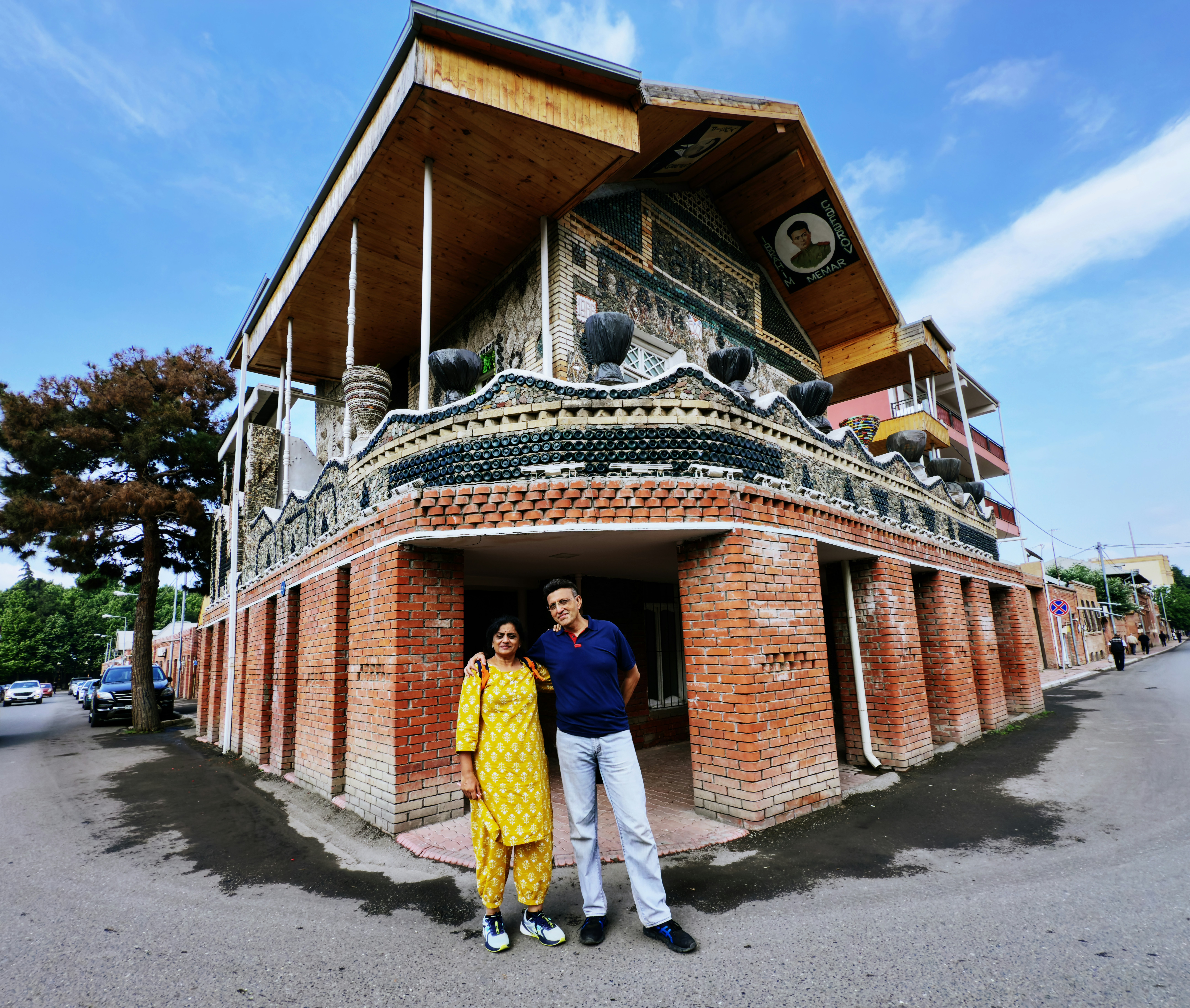 Colorful Brick Veranda Portrait in a Two-Story Curio House