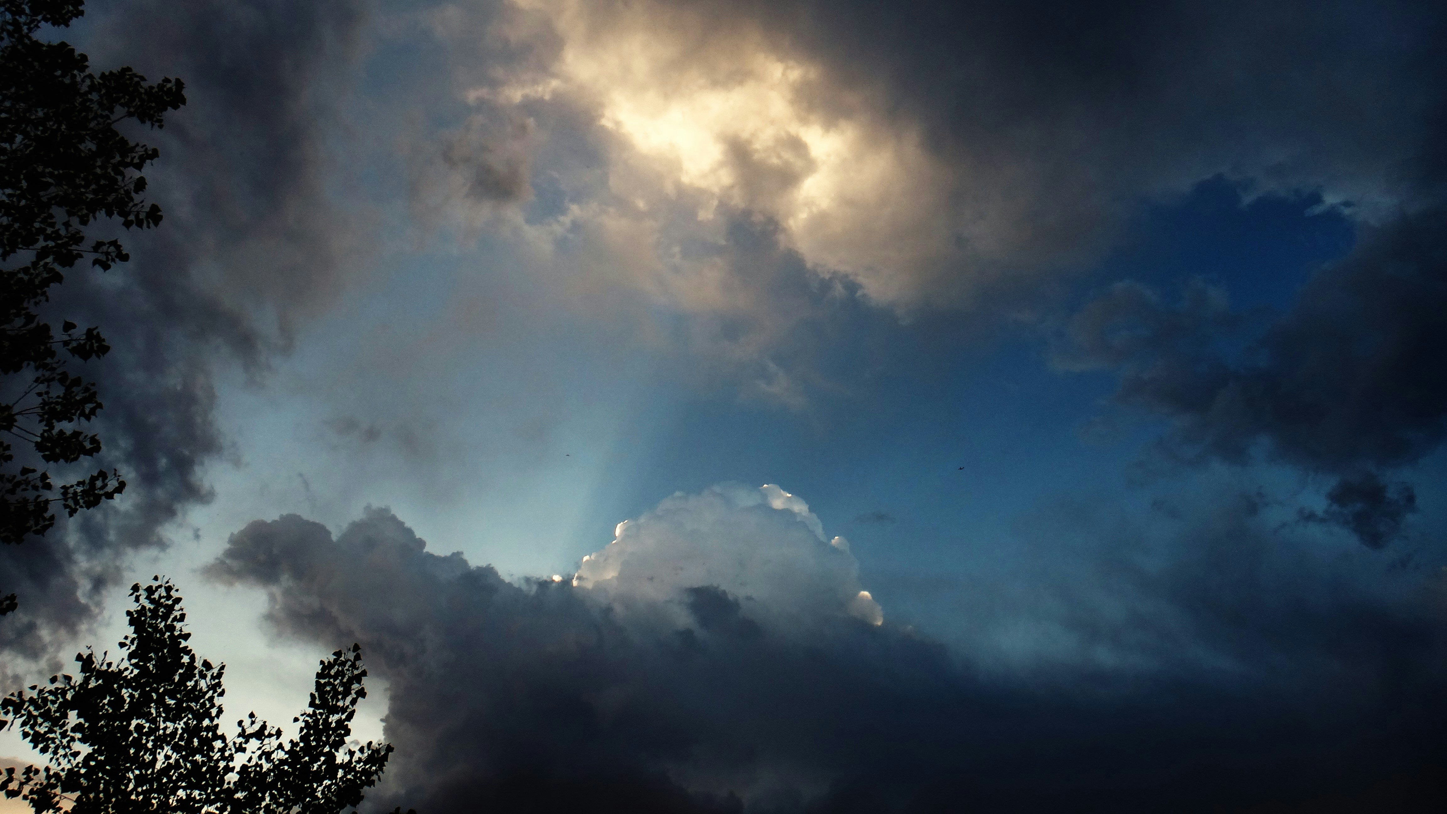 Rising Beam Through Cloud Break Over Evening Sky