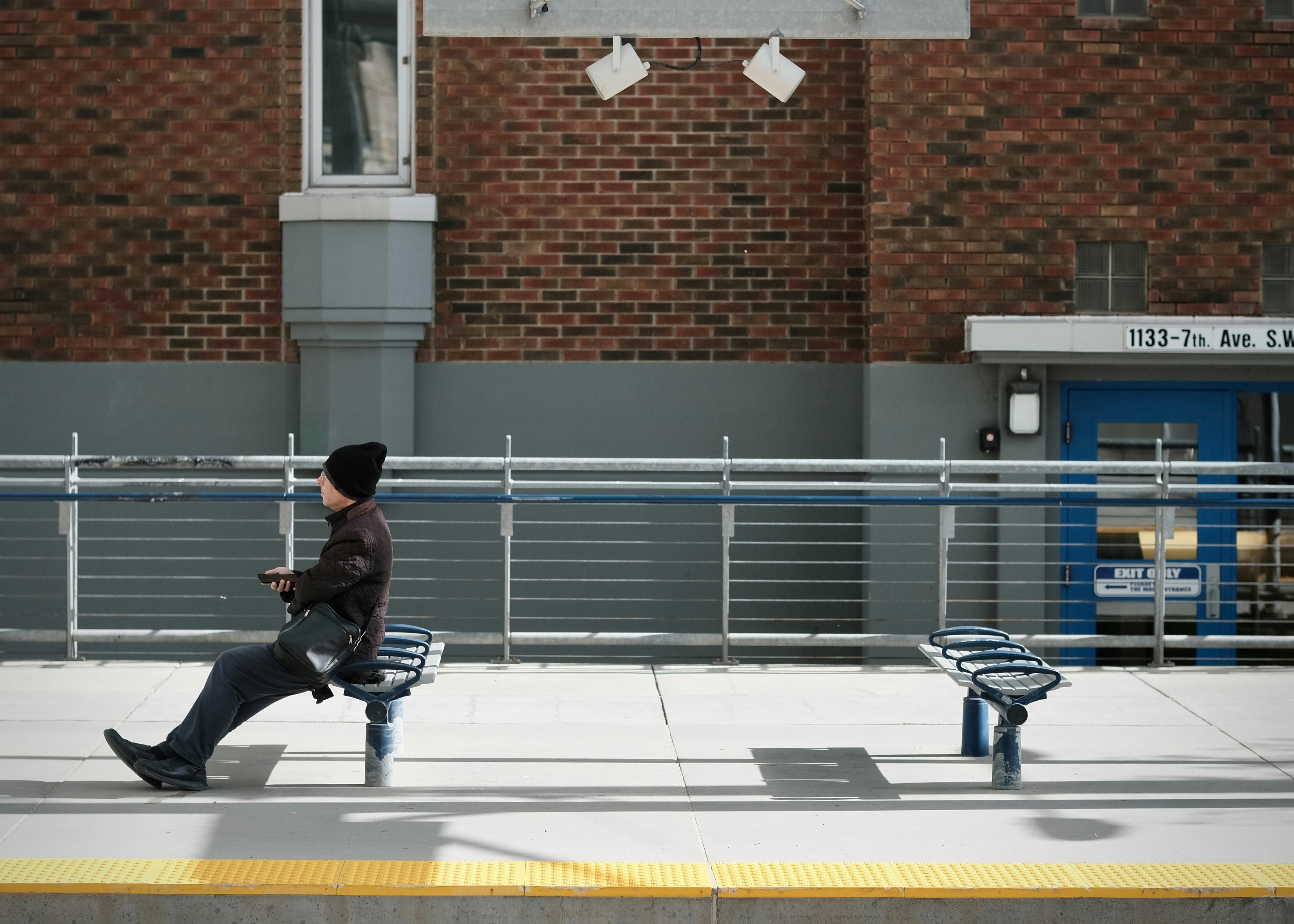 Urban Stationary: A Man in Motion at a Quiet Platform