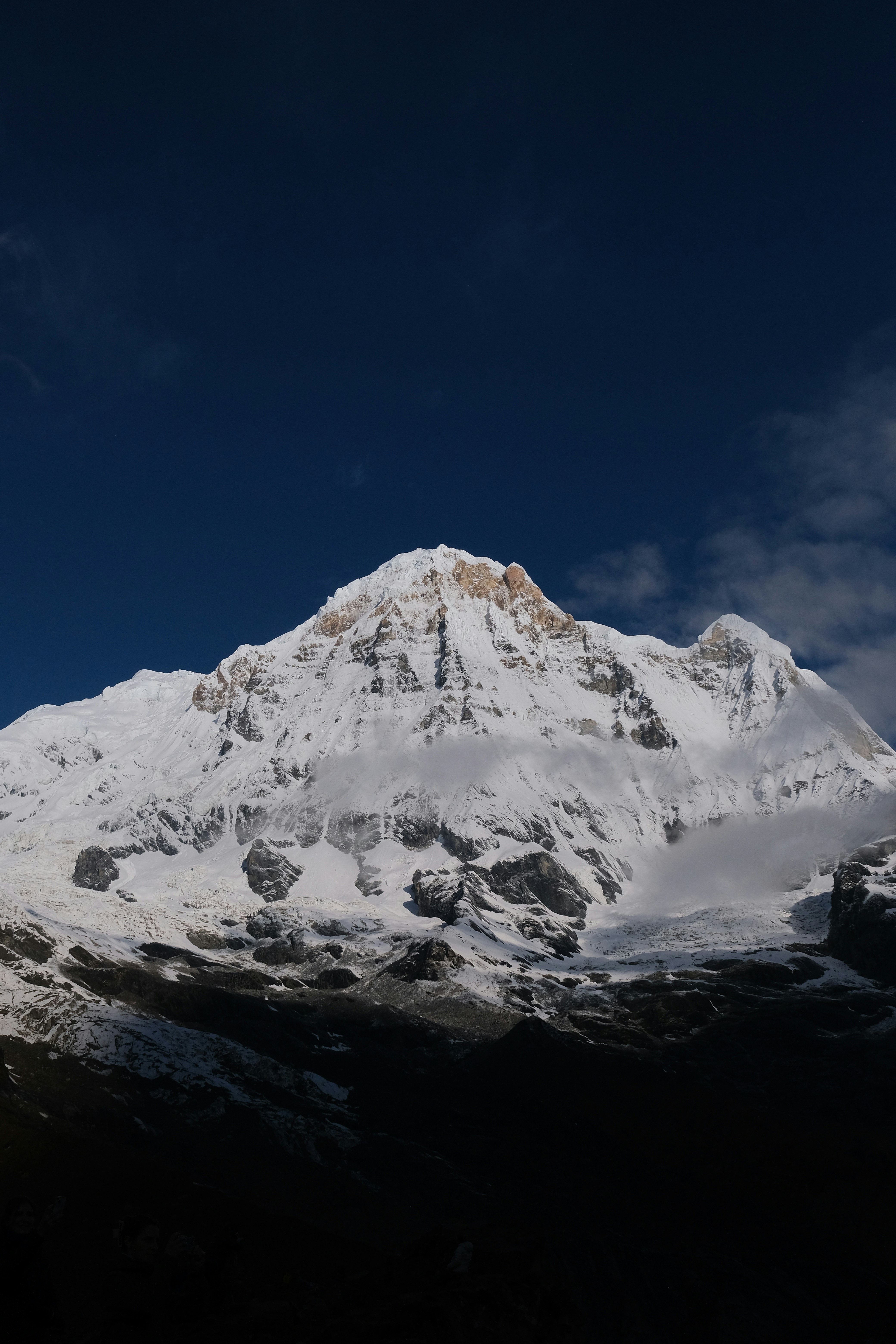 Snow-Capped Summit Under a Deep Blue Sky