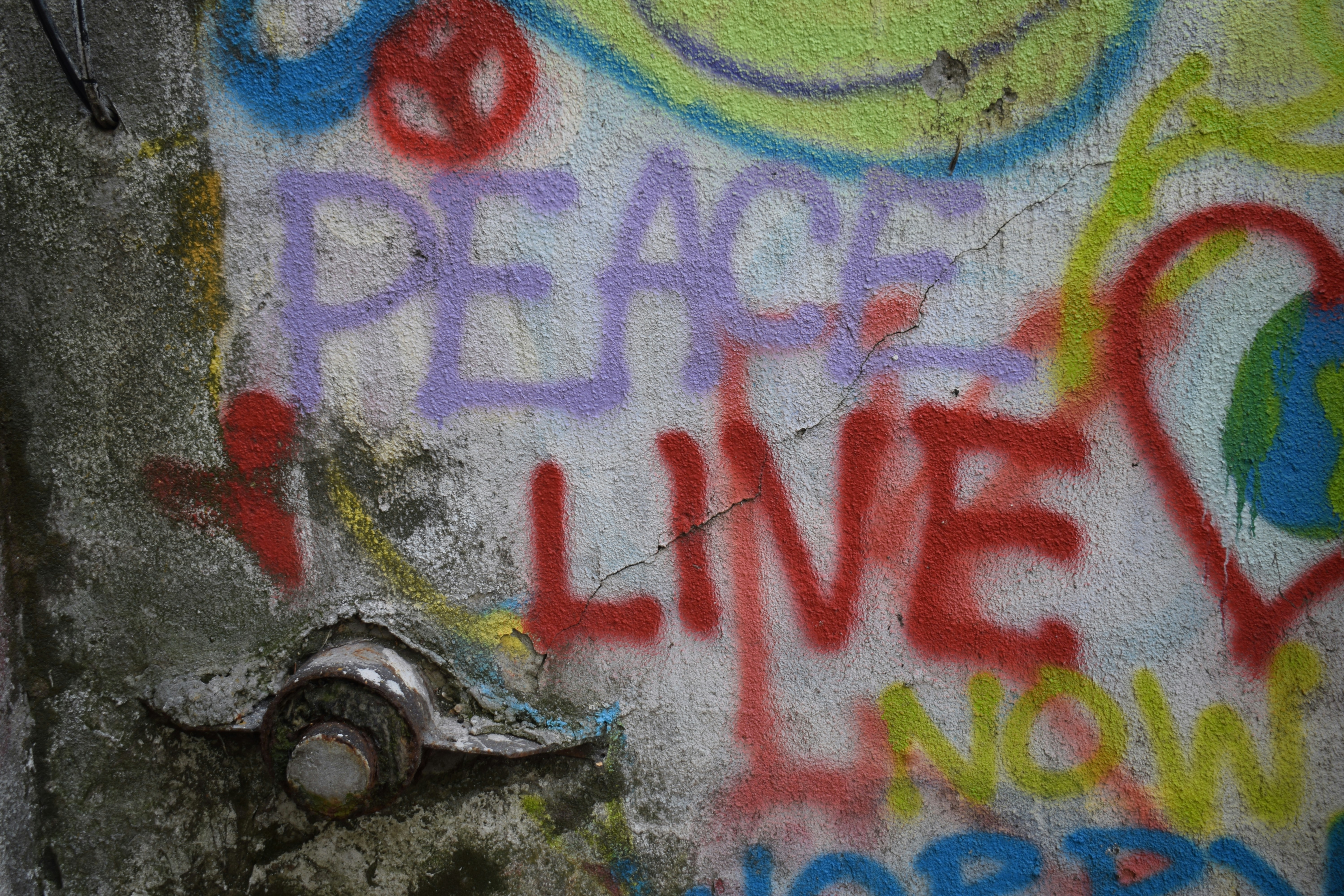 Graffiti Center: Peace, Lives on the Crumbling Wall