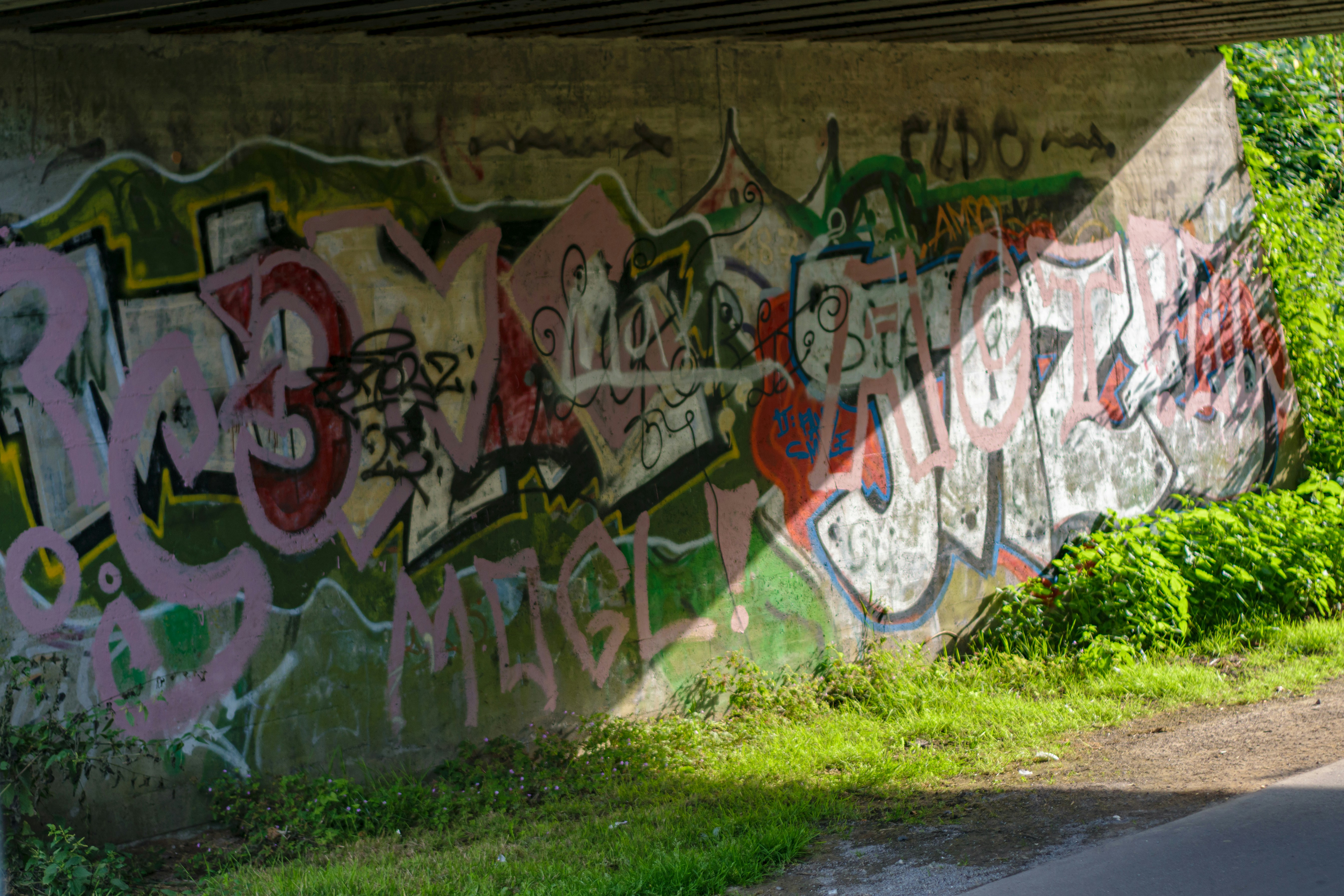 Graffitied Concrete Canvas Under Urban Light