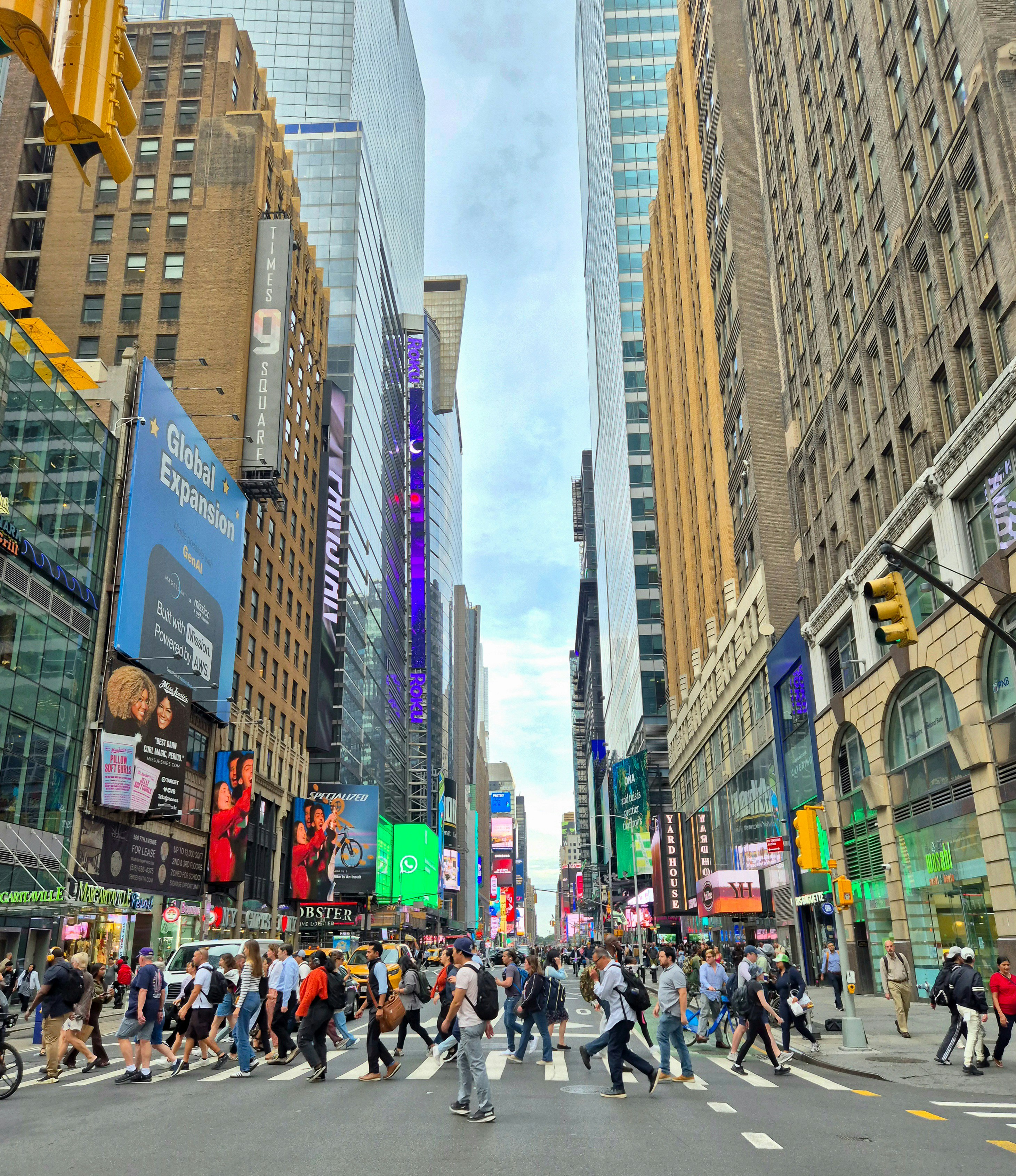 Crosswalk Convergence: People, Neon, and Skyscrapers in Time Square