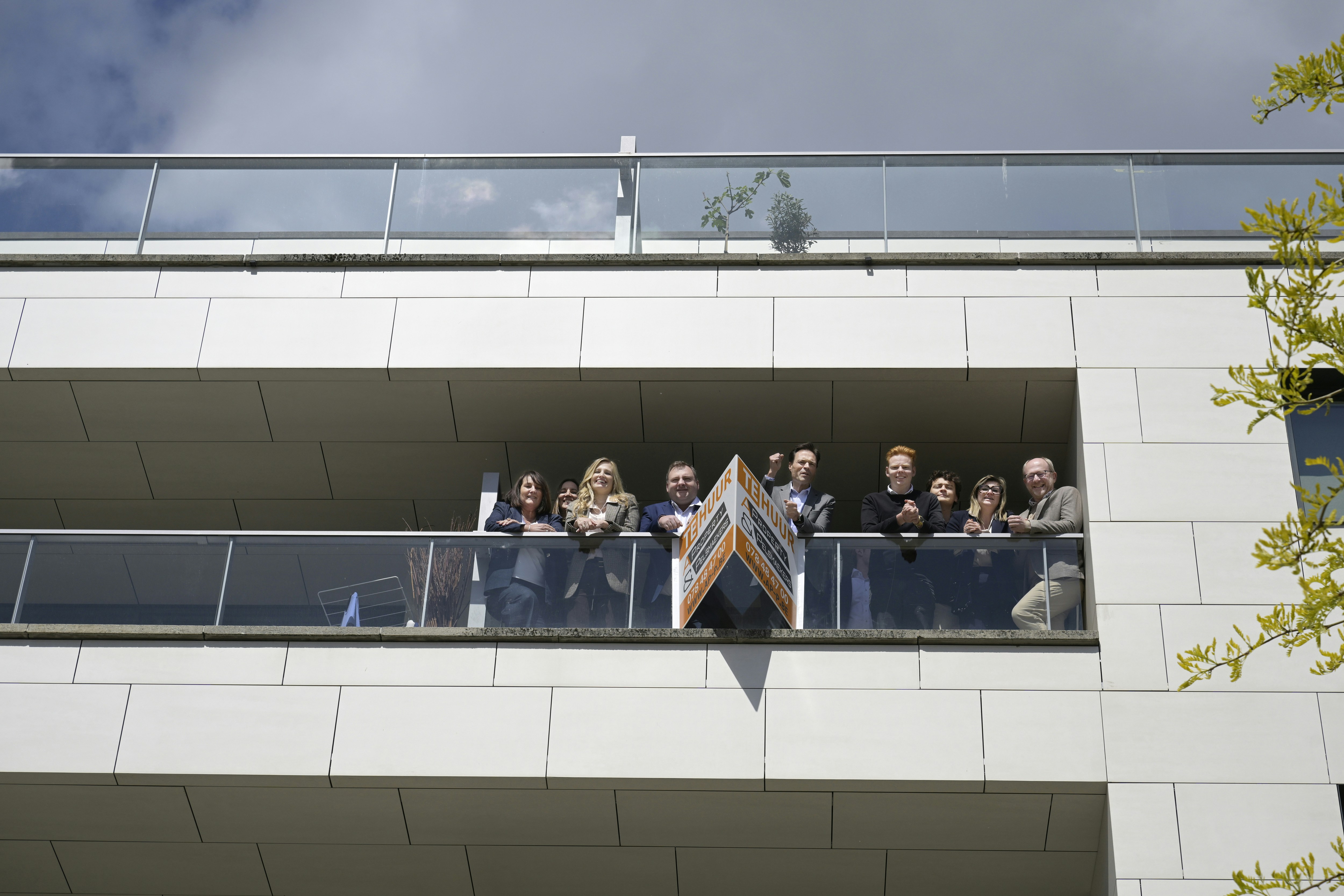 Urban Balcony Chorus: A Row of Observers Gathers on a Modern Terrace