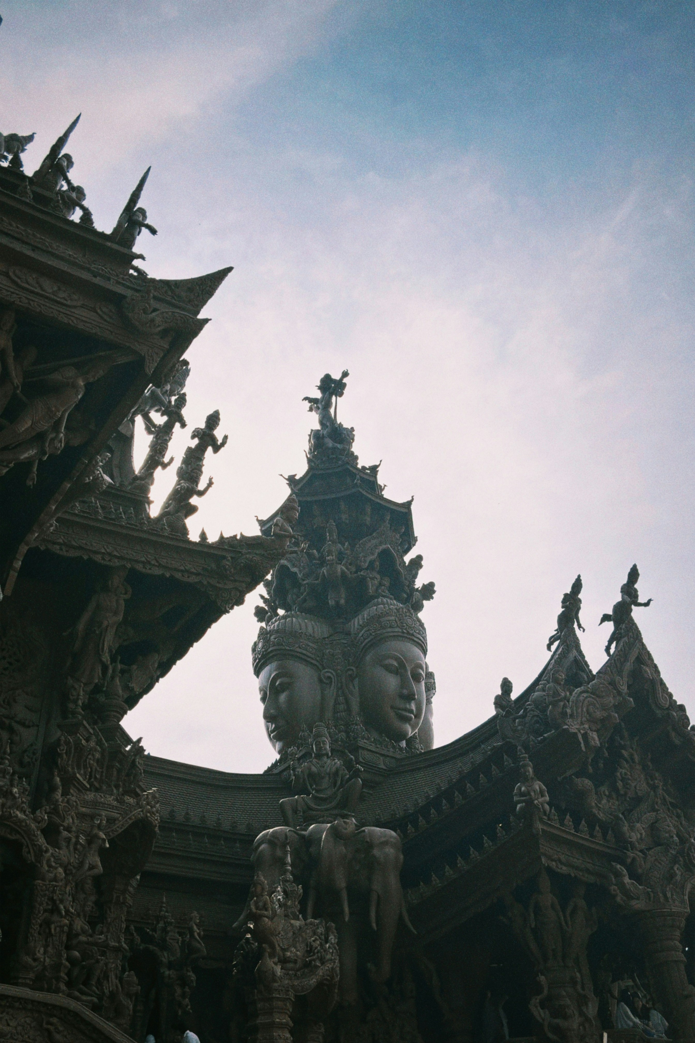 Towering Buddha Amid Intricate Carvings
