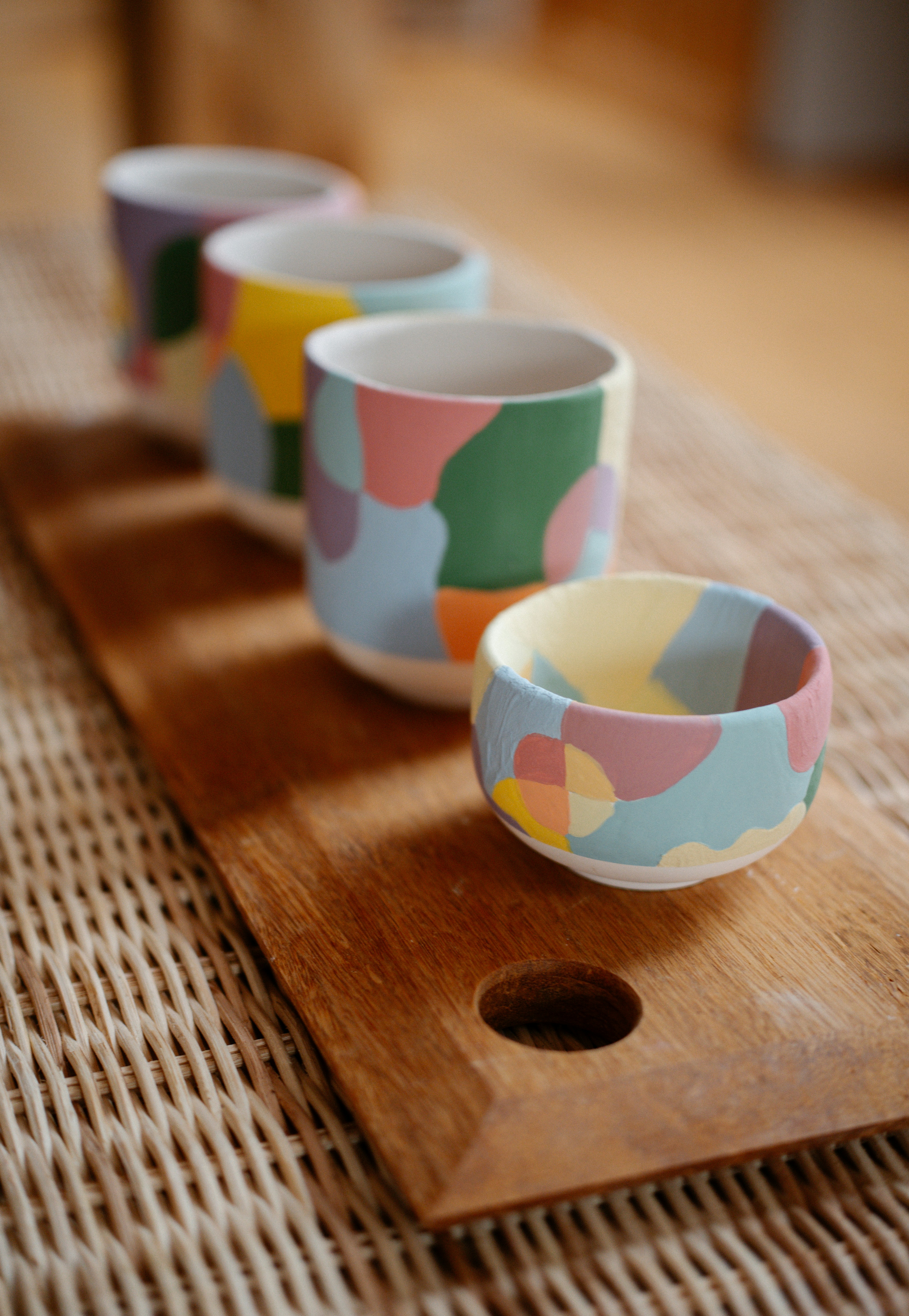 Colorful Ceramic Mugs on a Wooden Tray