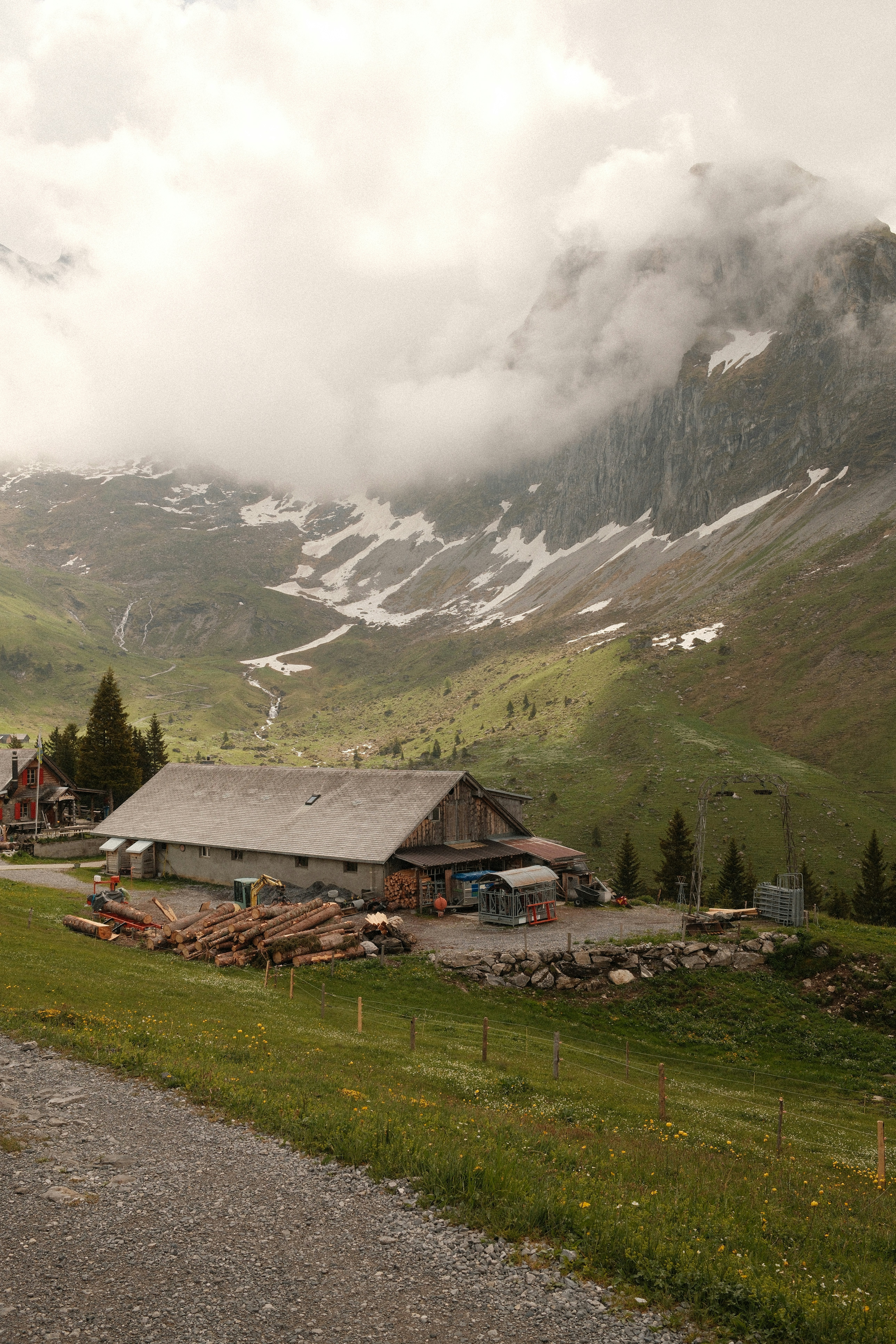 Alpine Refuge Beneath the Misty Crest