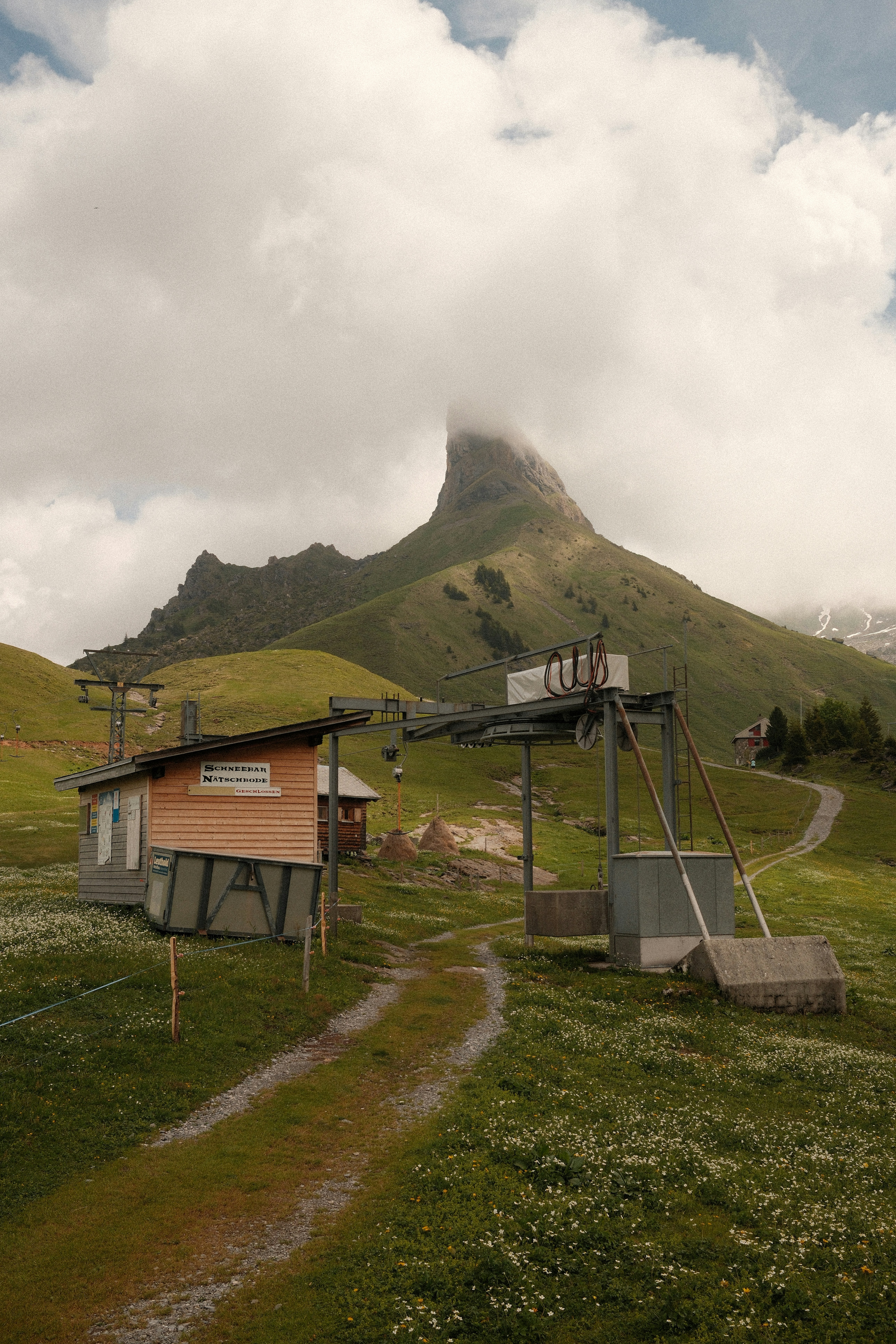 Mountain Lift Station Beneath a Cloud-Wreathed Peak