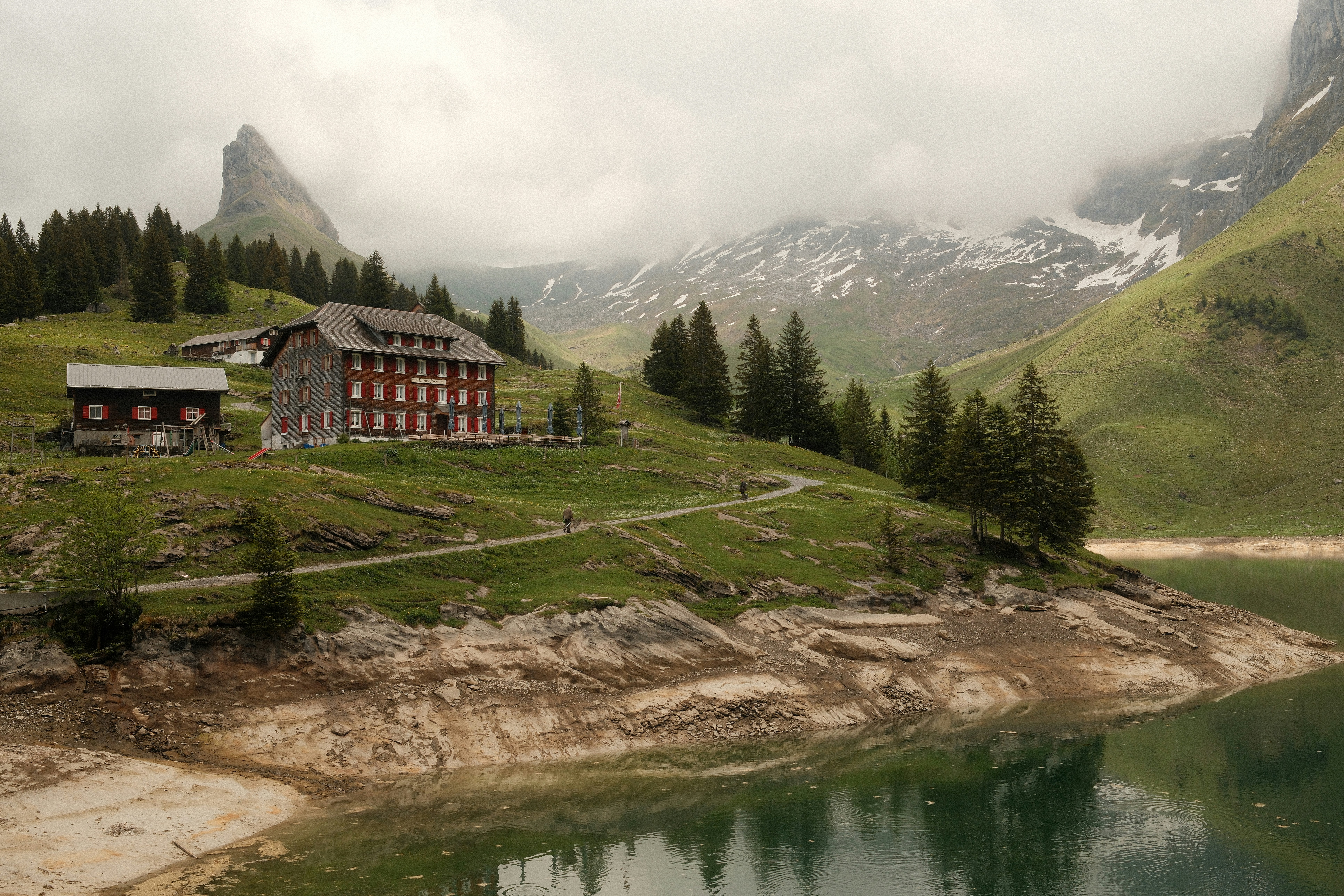 Lakeside Alpine Retreat under Cloud-kissed Peaks