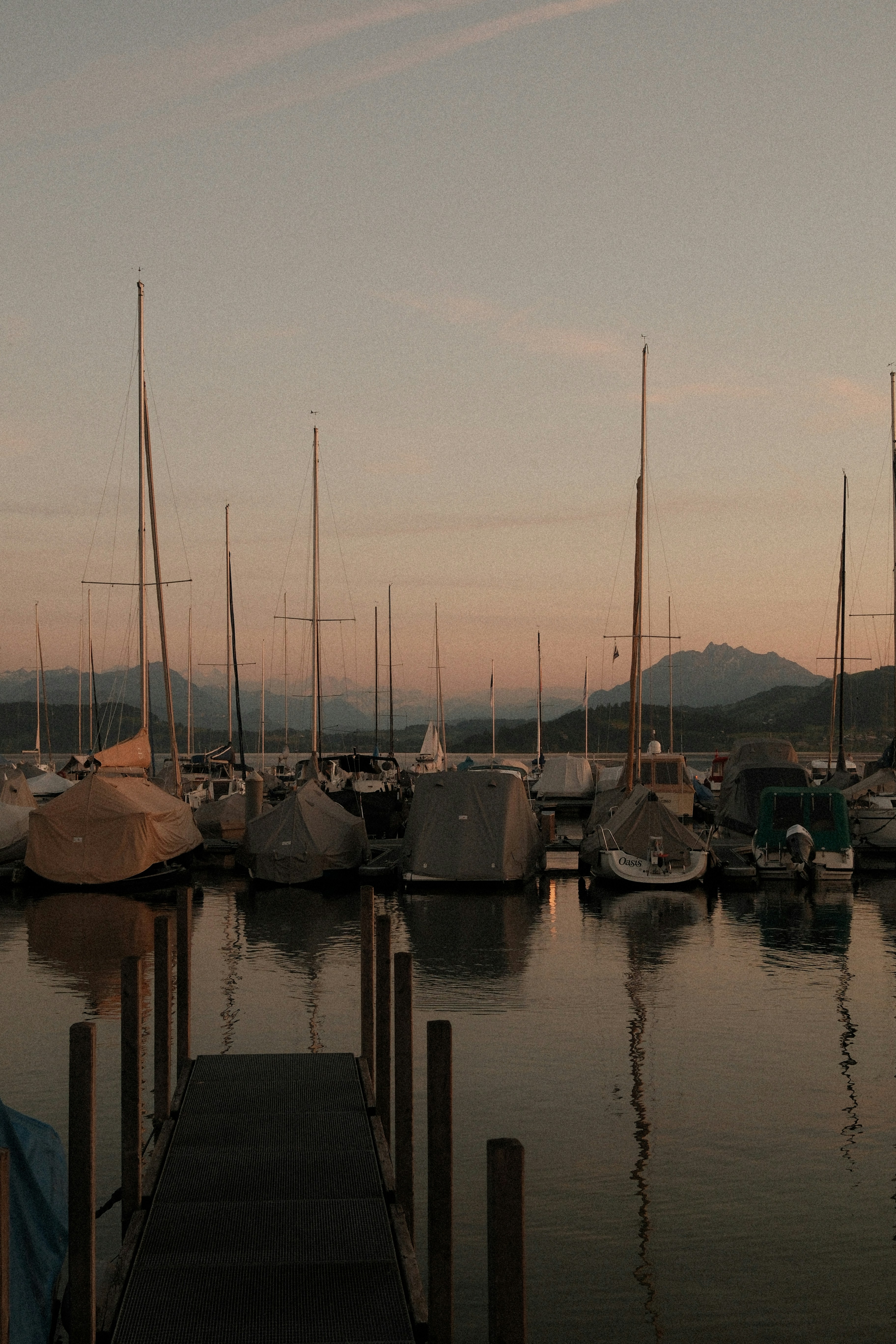 Silent Docks at Dusk: Boats Resting on Mirror-like Water