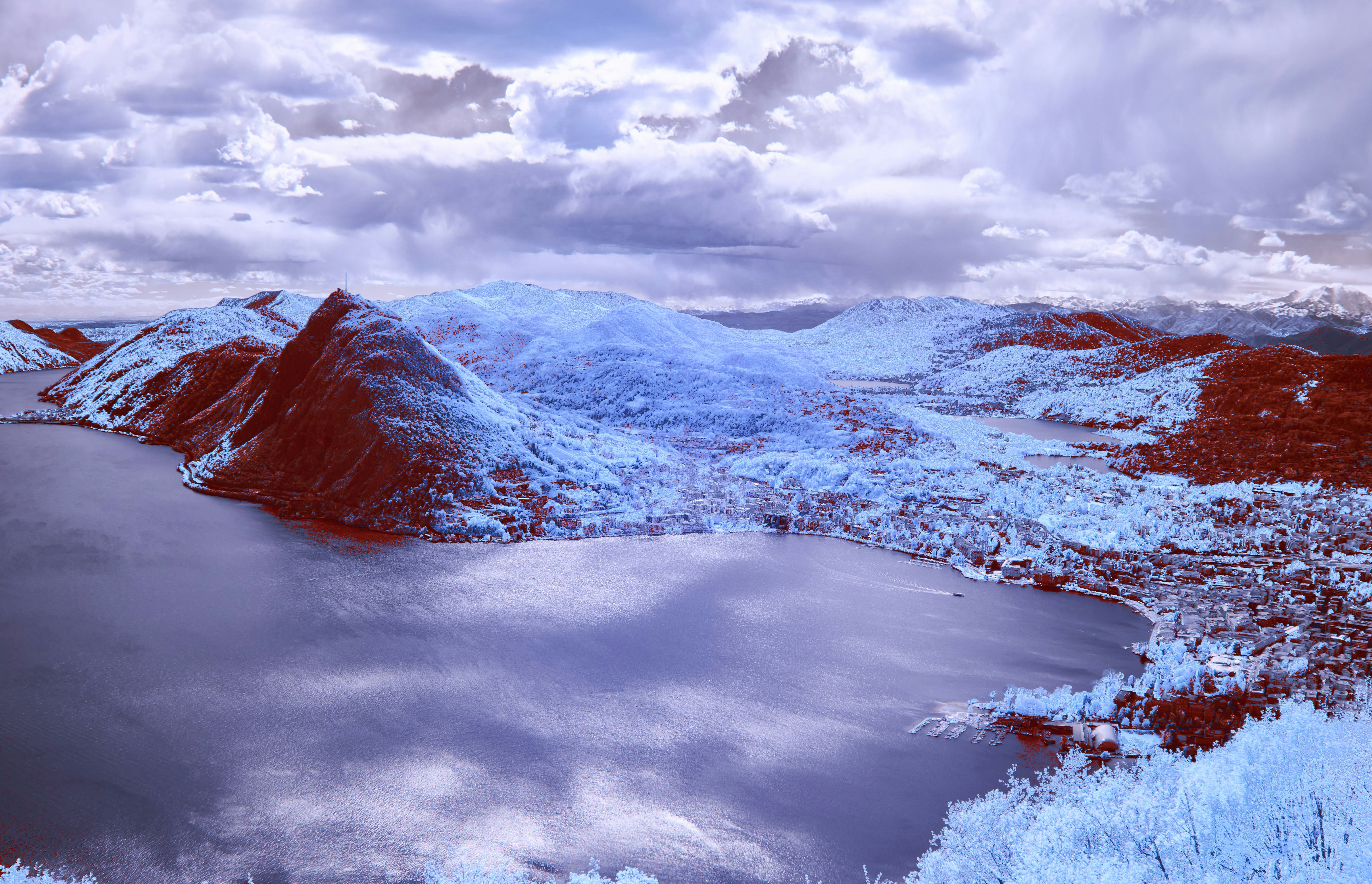 Icy Dawn in Infrared Veil: A Lunar Lake Amid Crimson Hills