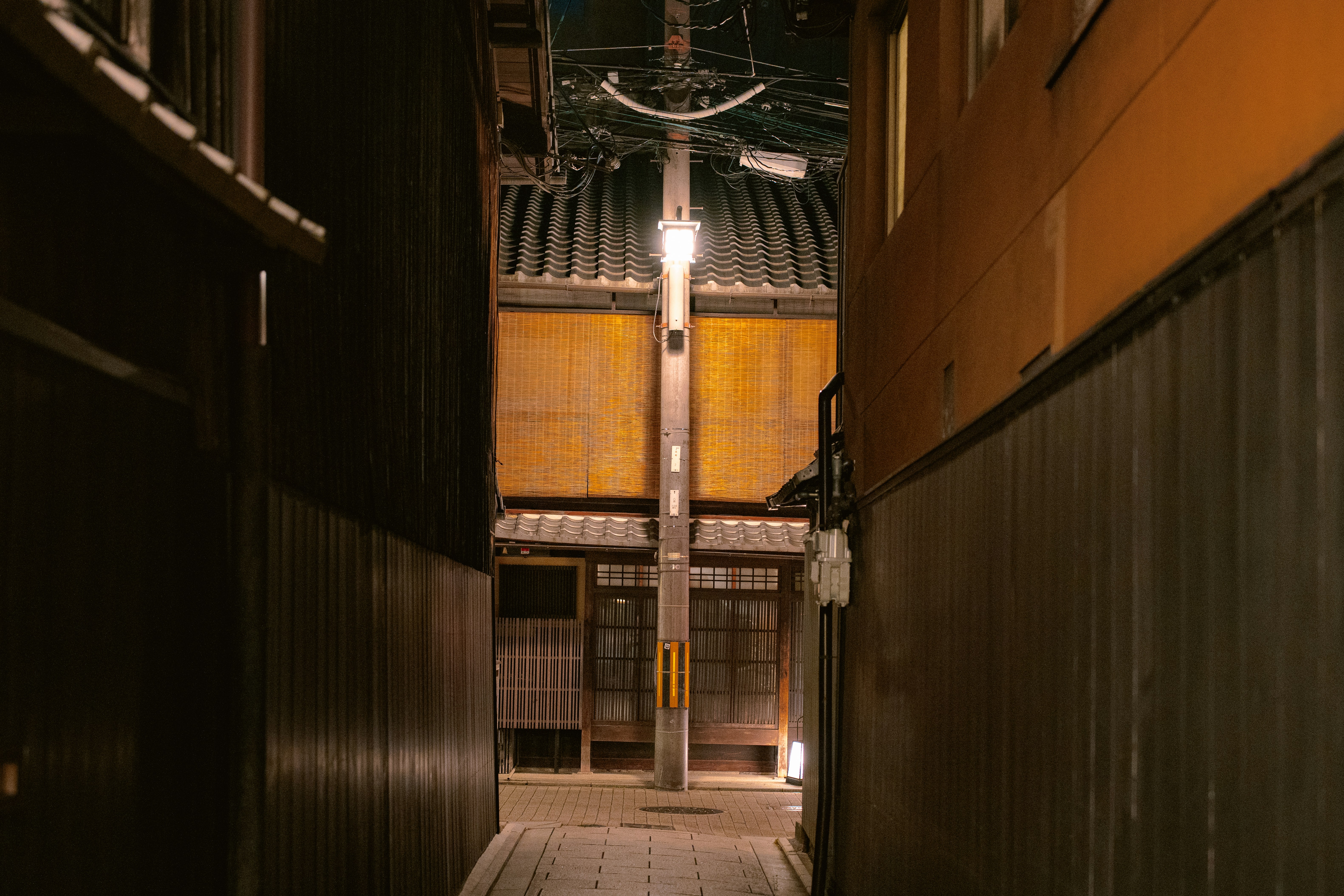Quiet Neon Corridor: Street-level Light Through a Narrow Passage