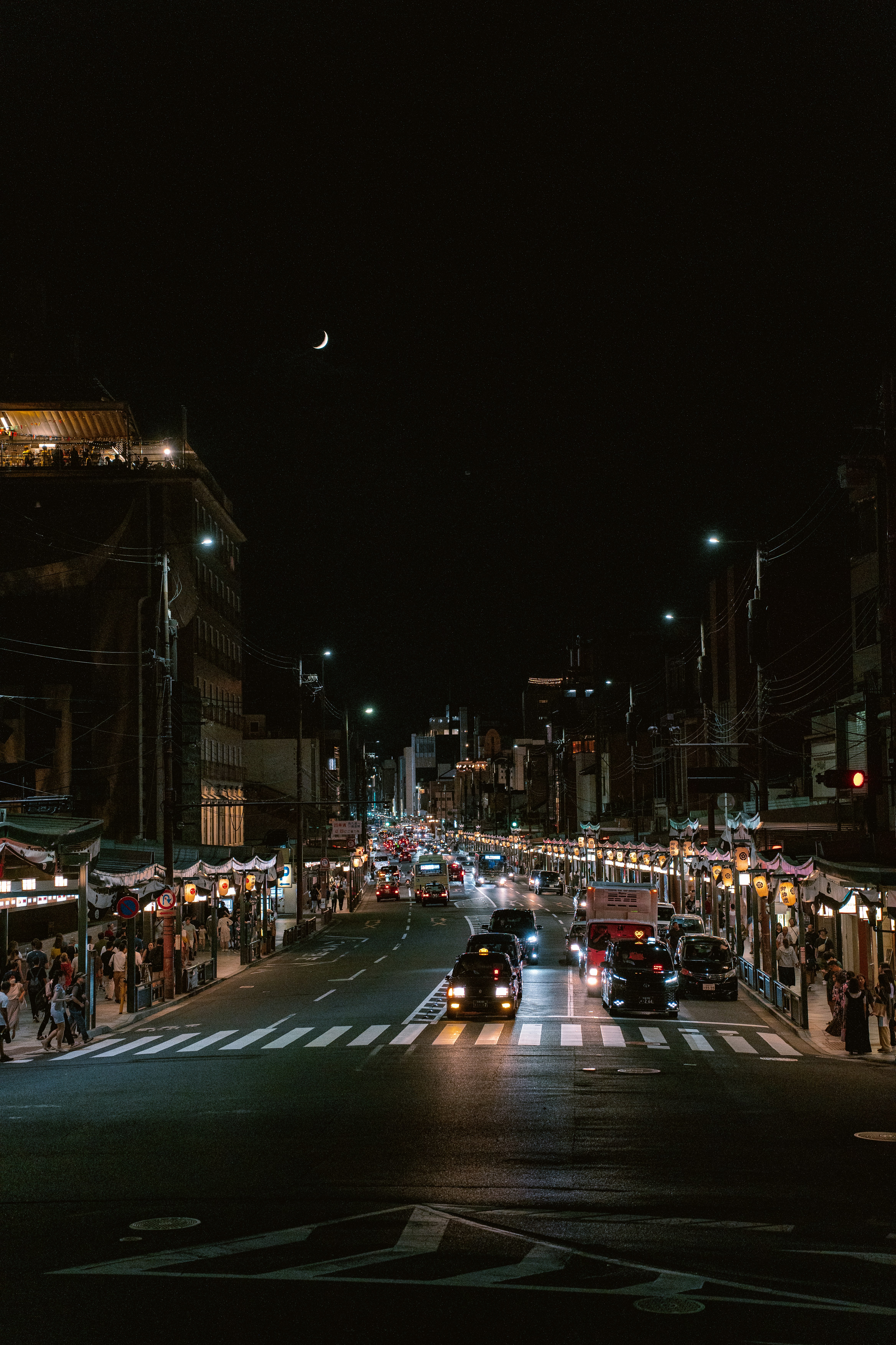  Neon Nightfall: City Street Pulse Under a Crescent Moon