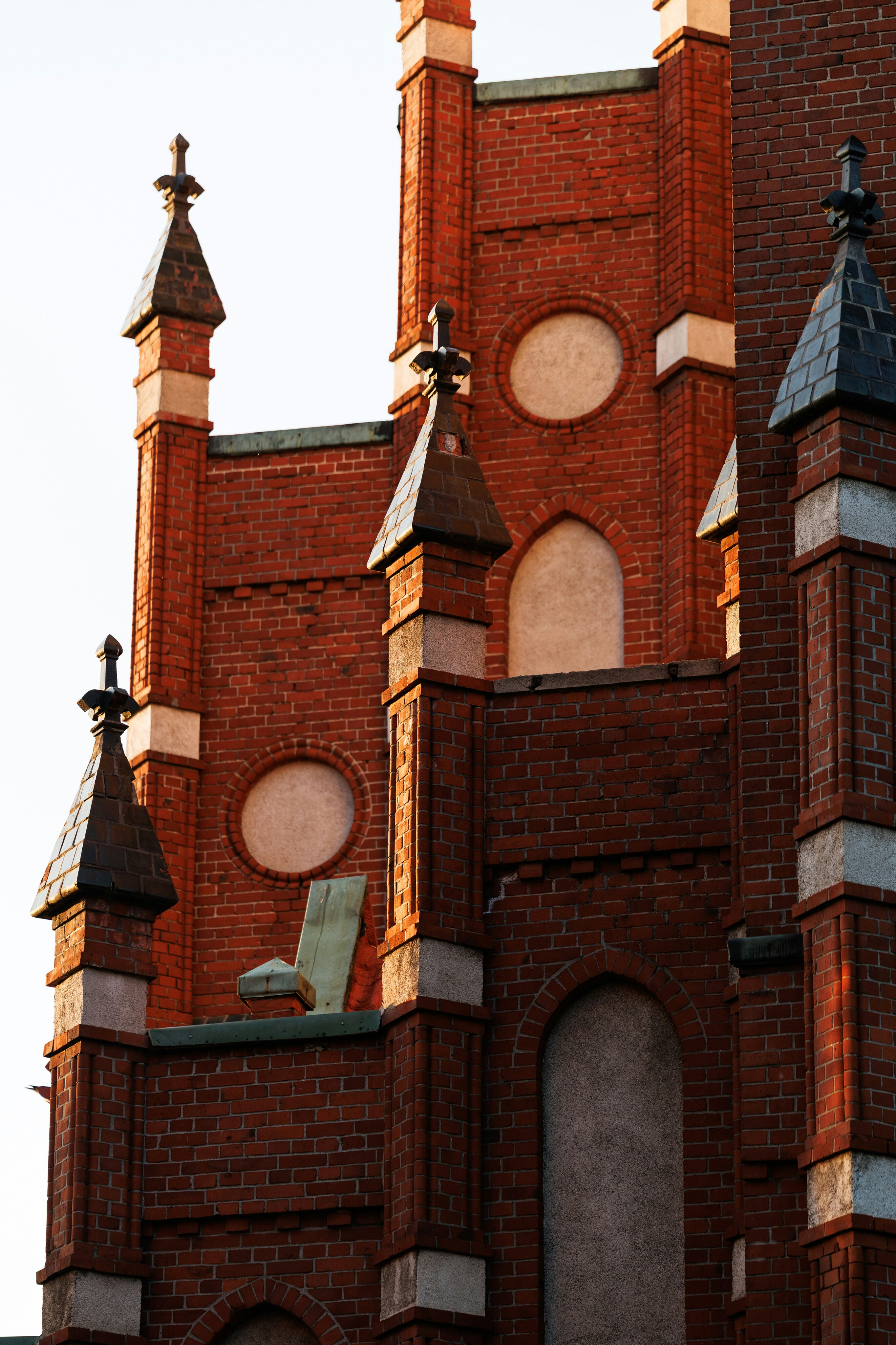 Brick Gothic: Vertical Towers and Circular Niches of a Red Fortress