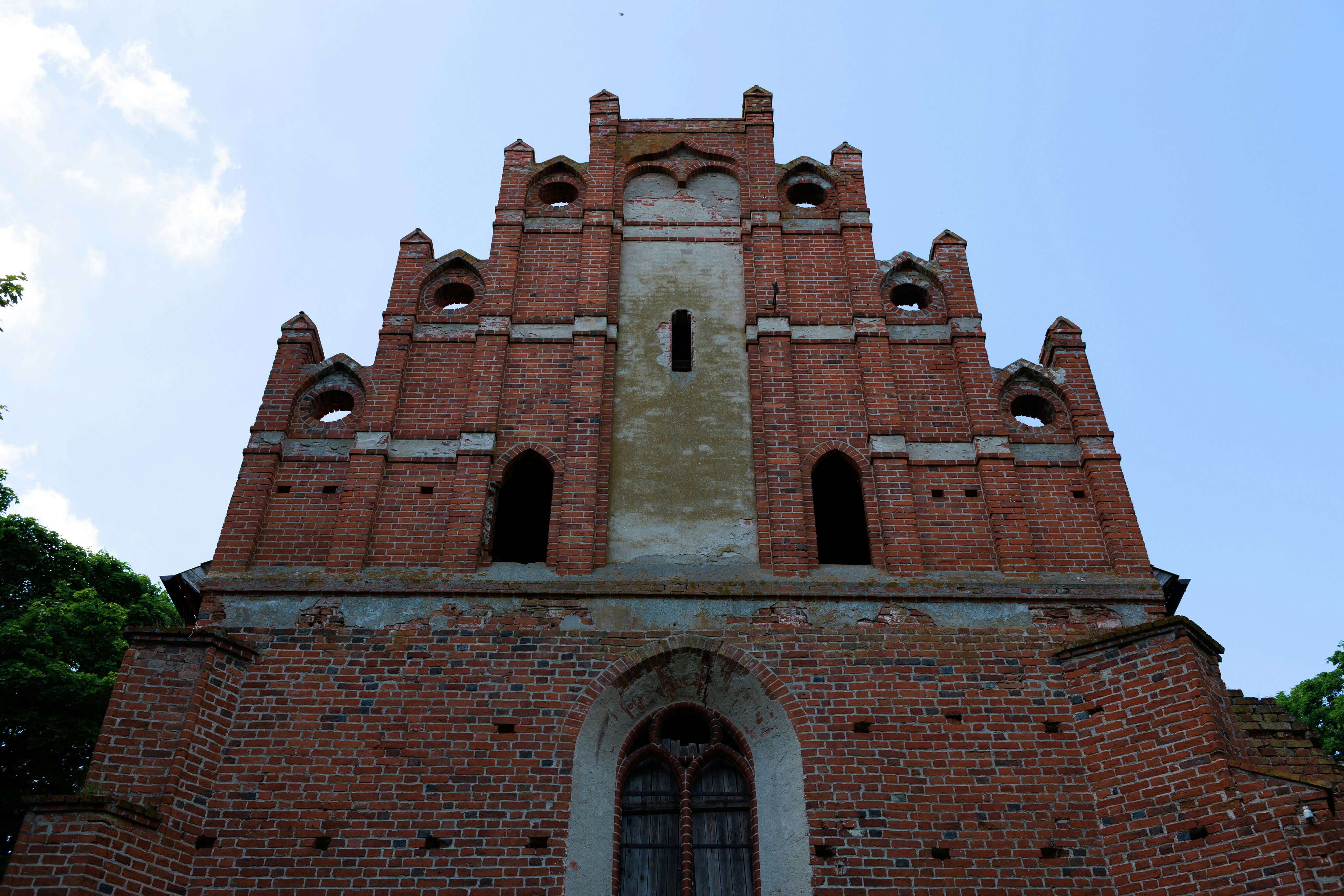 Ruined Brick Chapel Reaching Toward a Blue Sky