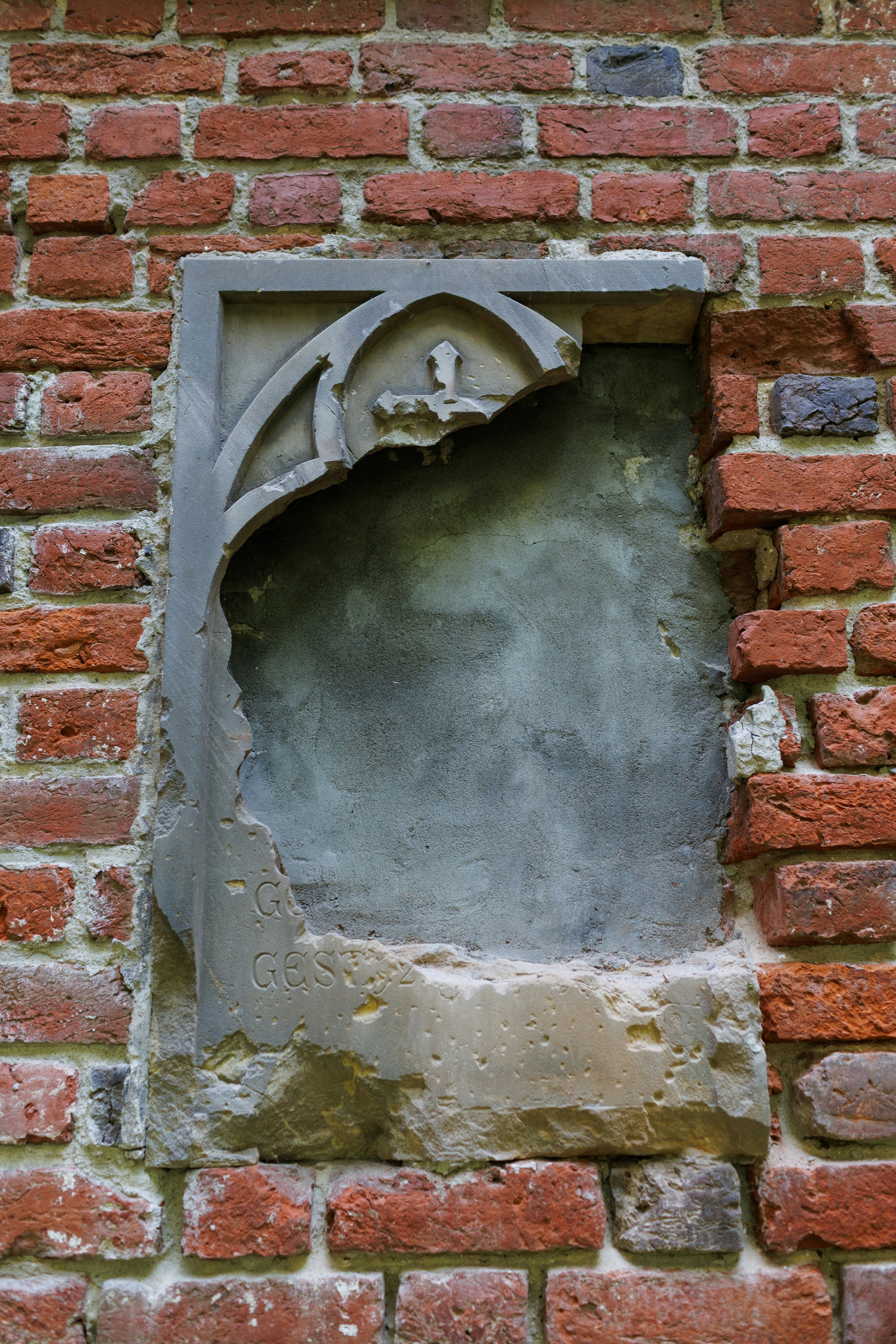 Weathered Stone Altar Framed by Crimson Brickwork