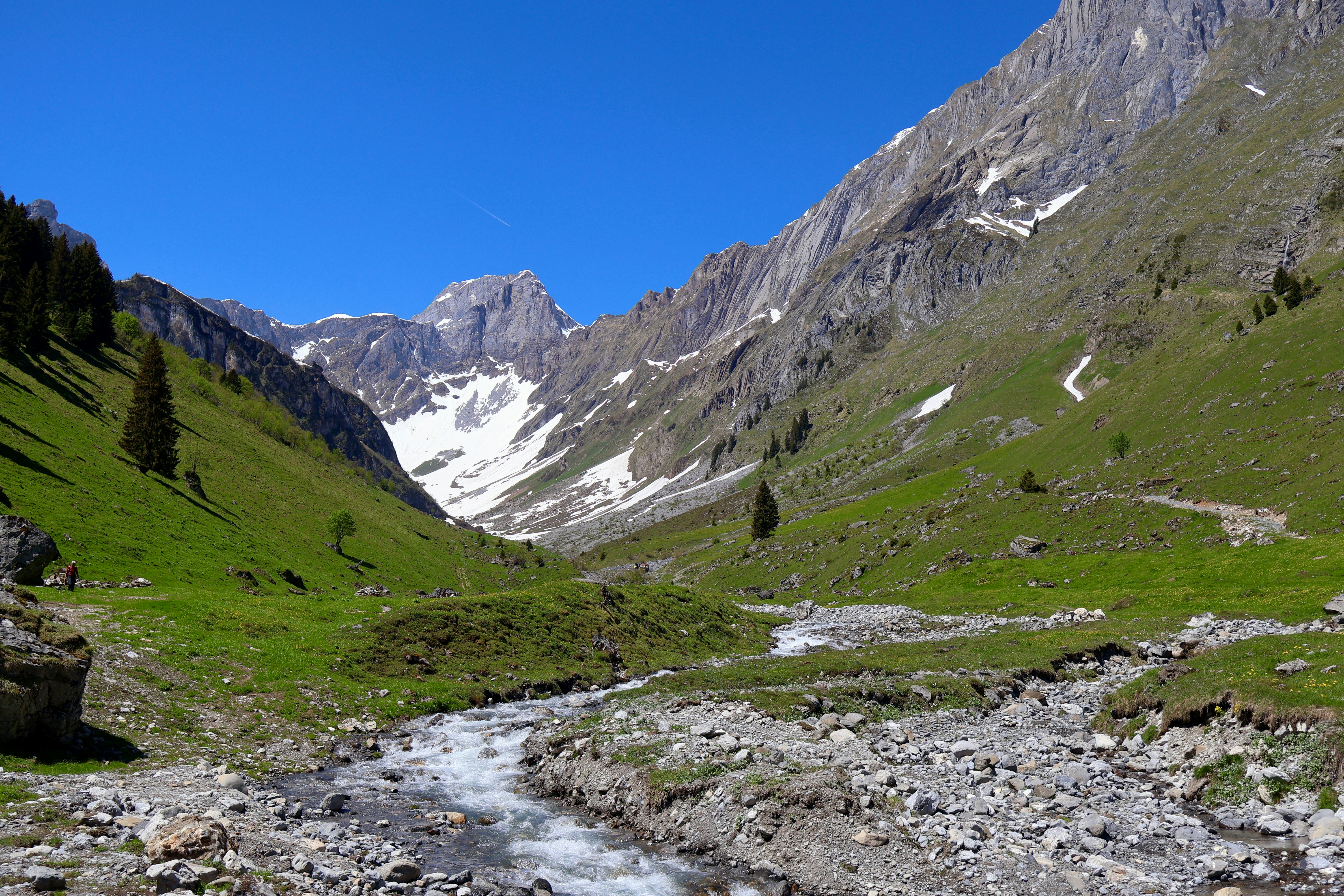 Snow-capped valley under a cobalt sky