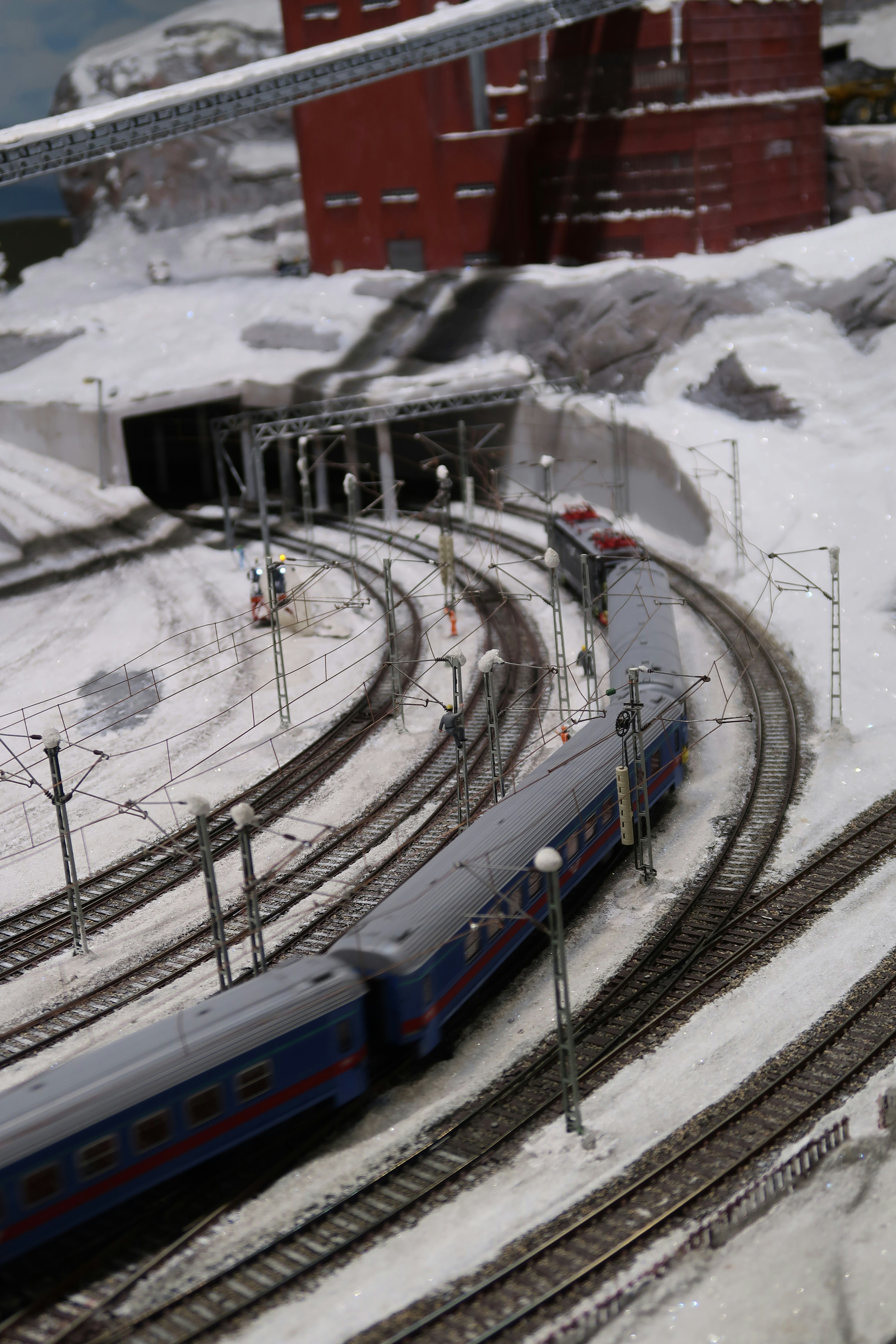 Snowbound Rail Odyssey: Trains Winding Through a Mountain Tunnel