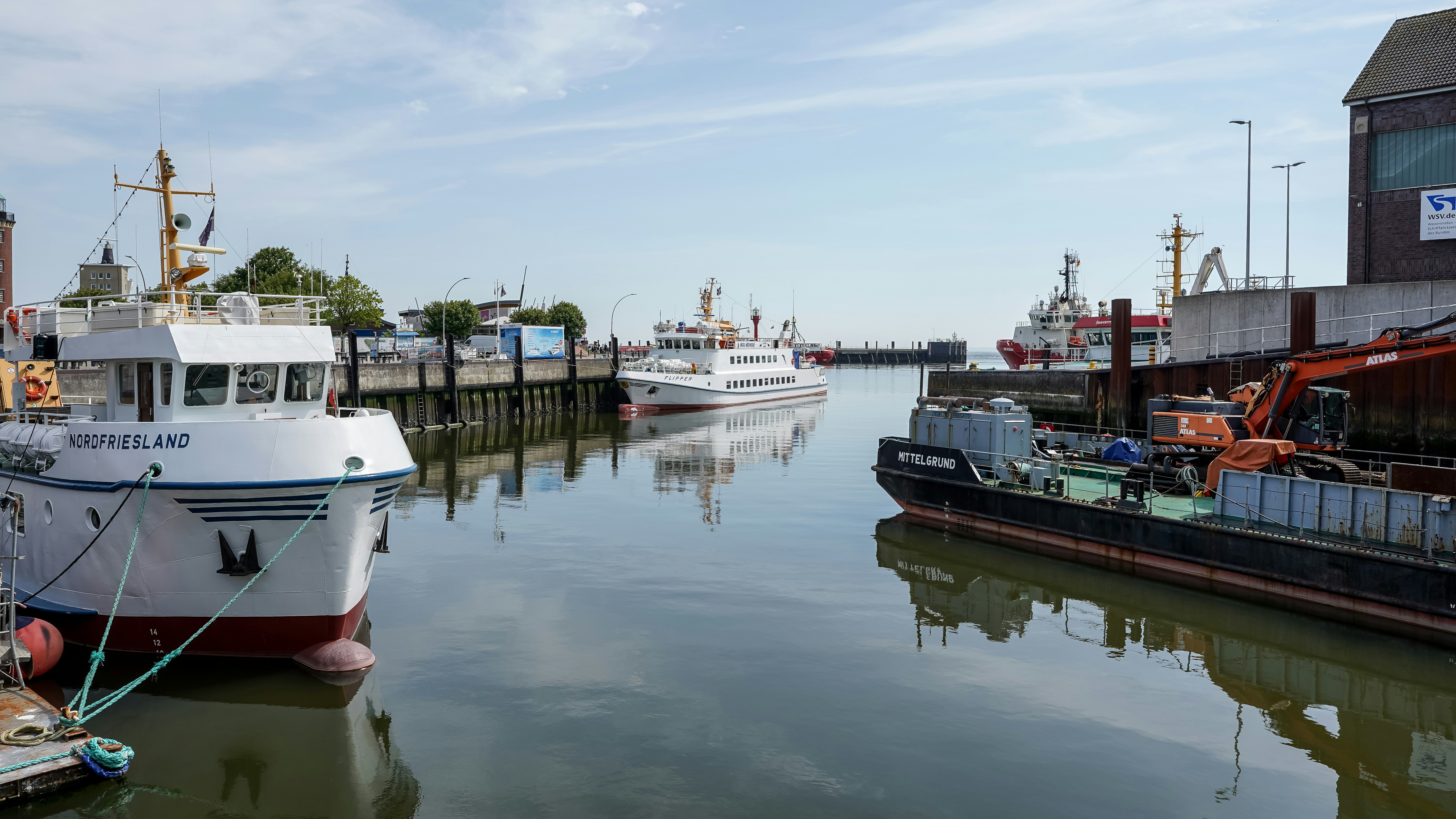 Harbor in Calm Light: Boats and Reflections at Golden Hour