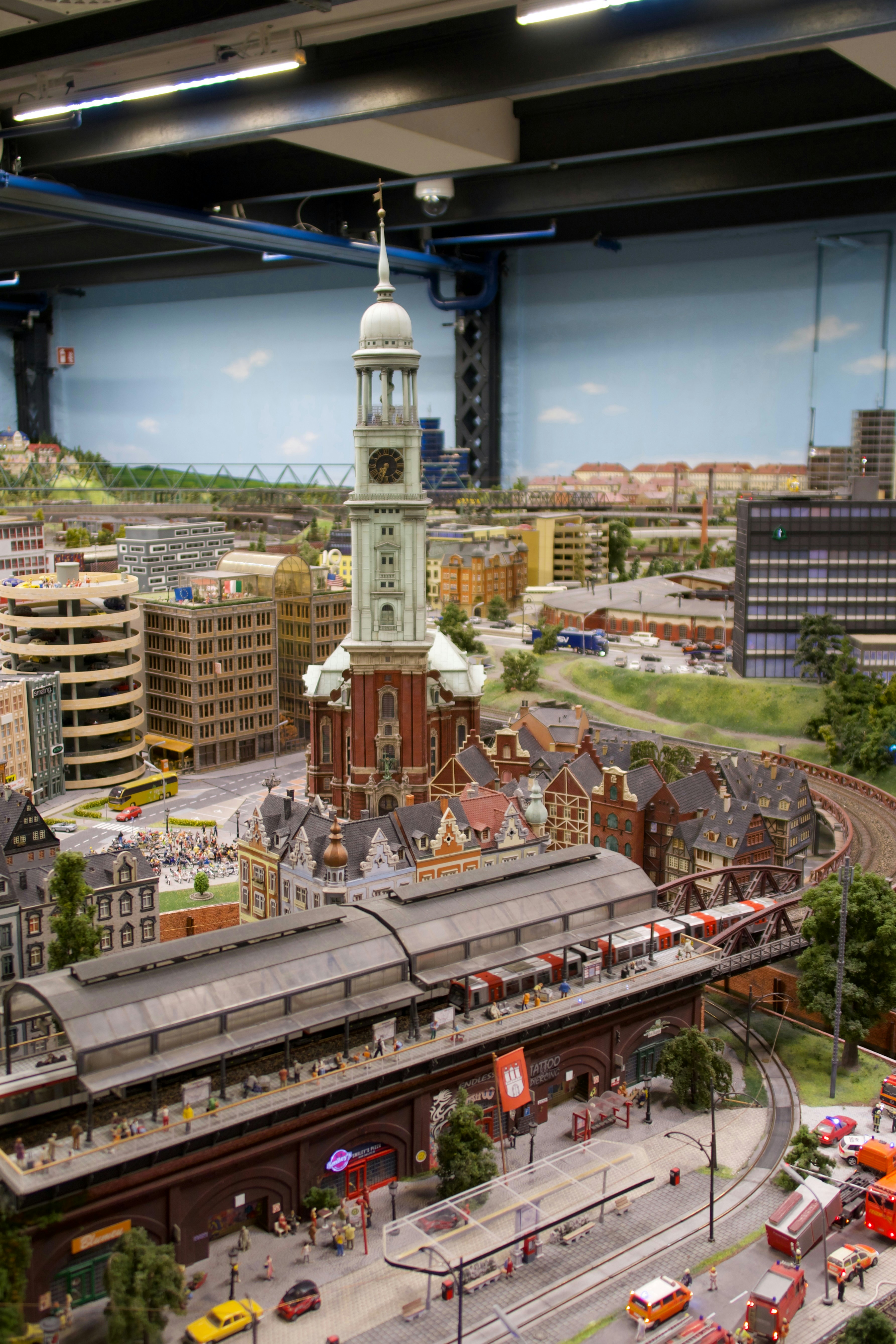 Clock Tower Over a Lively Miniature Cityscape