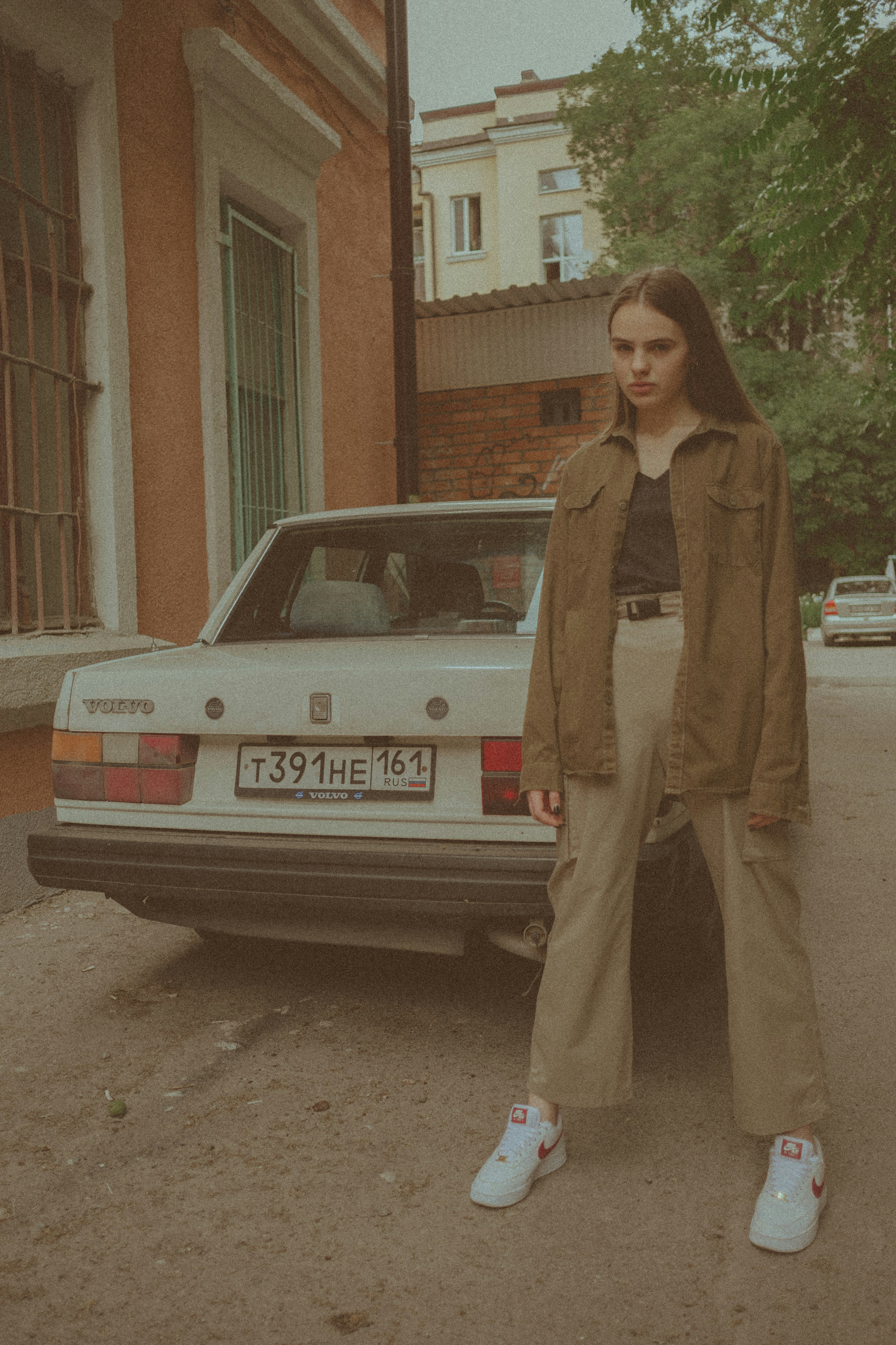Rugged Street Portrait by a Parked Volvo