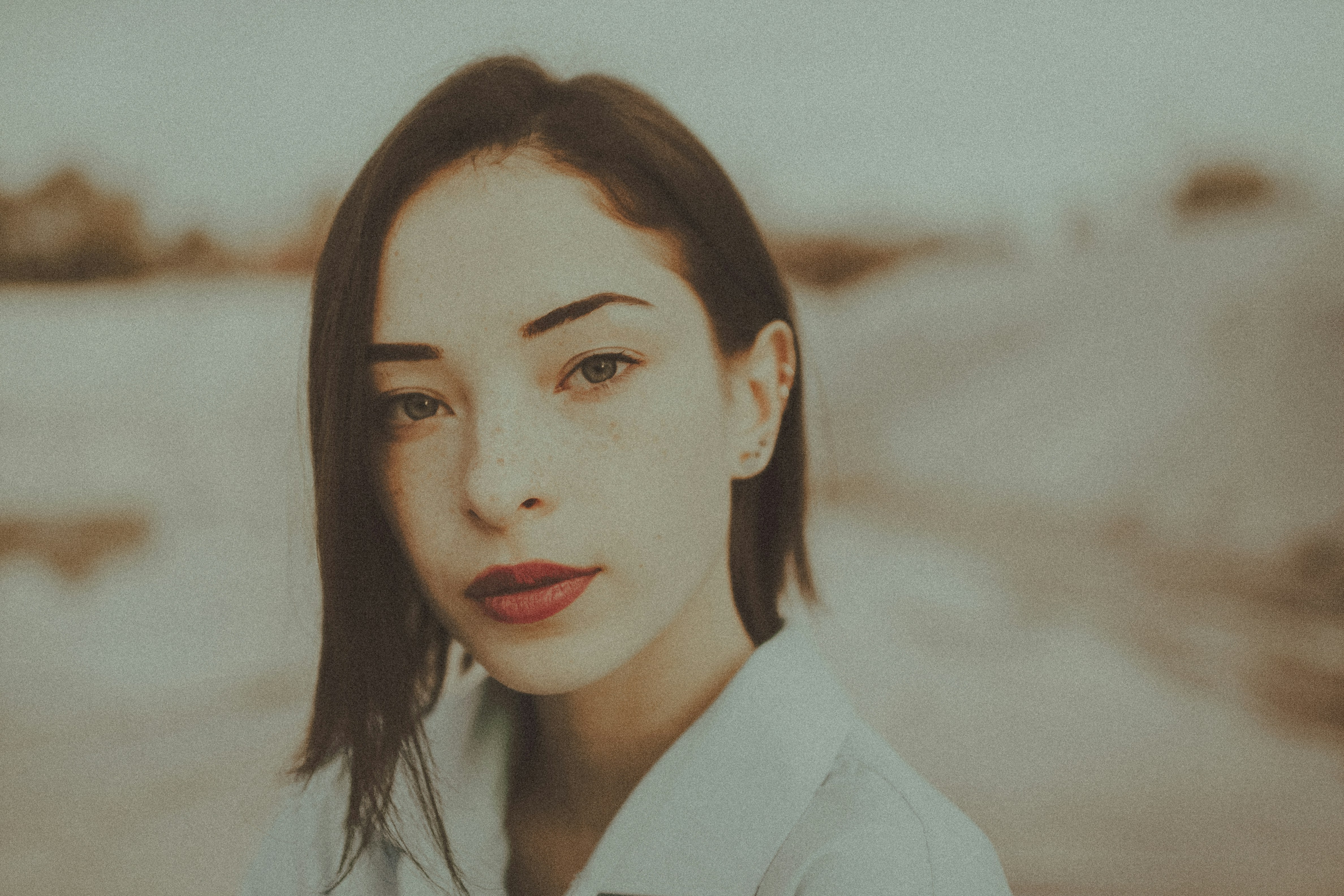 Portrait in Soft Sepia: A Quiet Gaze at the Lens