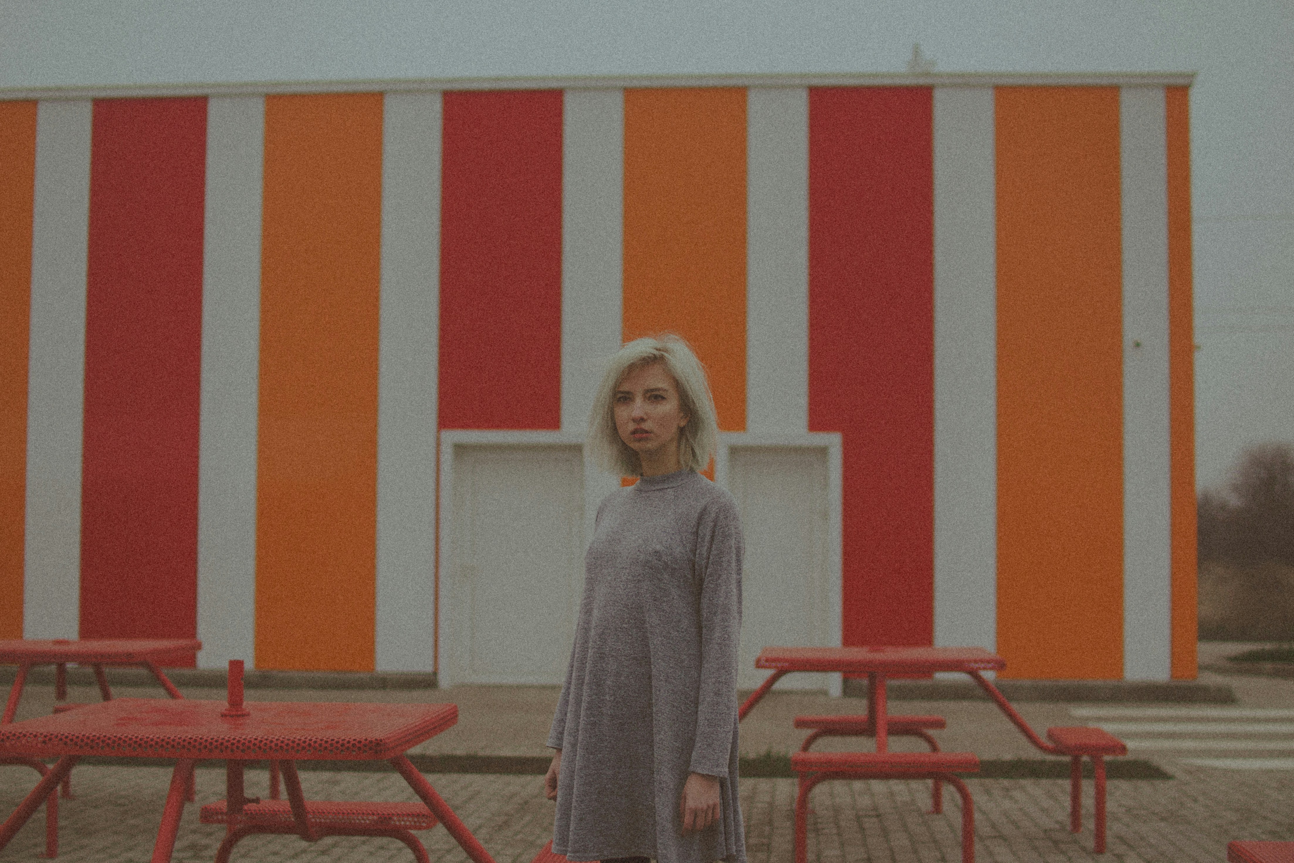 Portrait in Front of a Striped Orange Wall