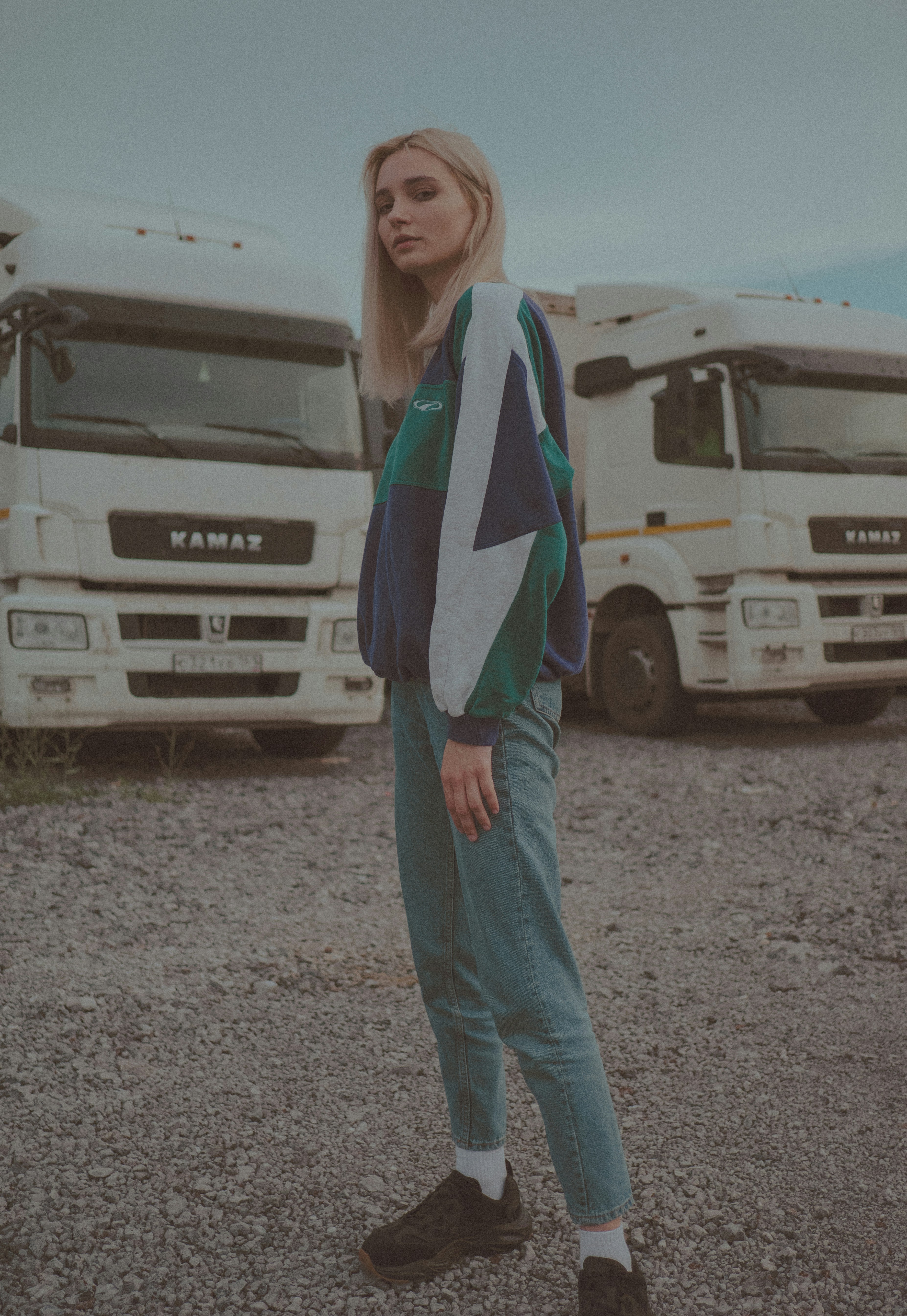 Labelled in Transit: A Quiet Portrait Amid Trucks